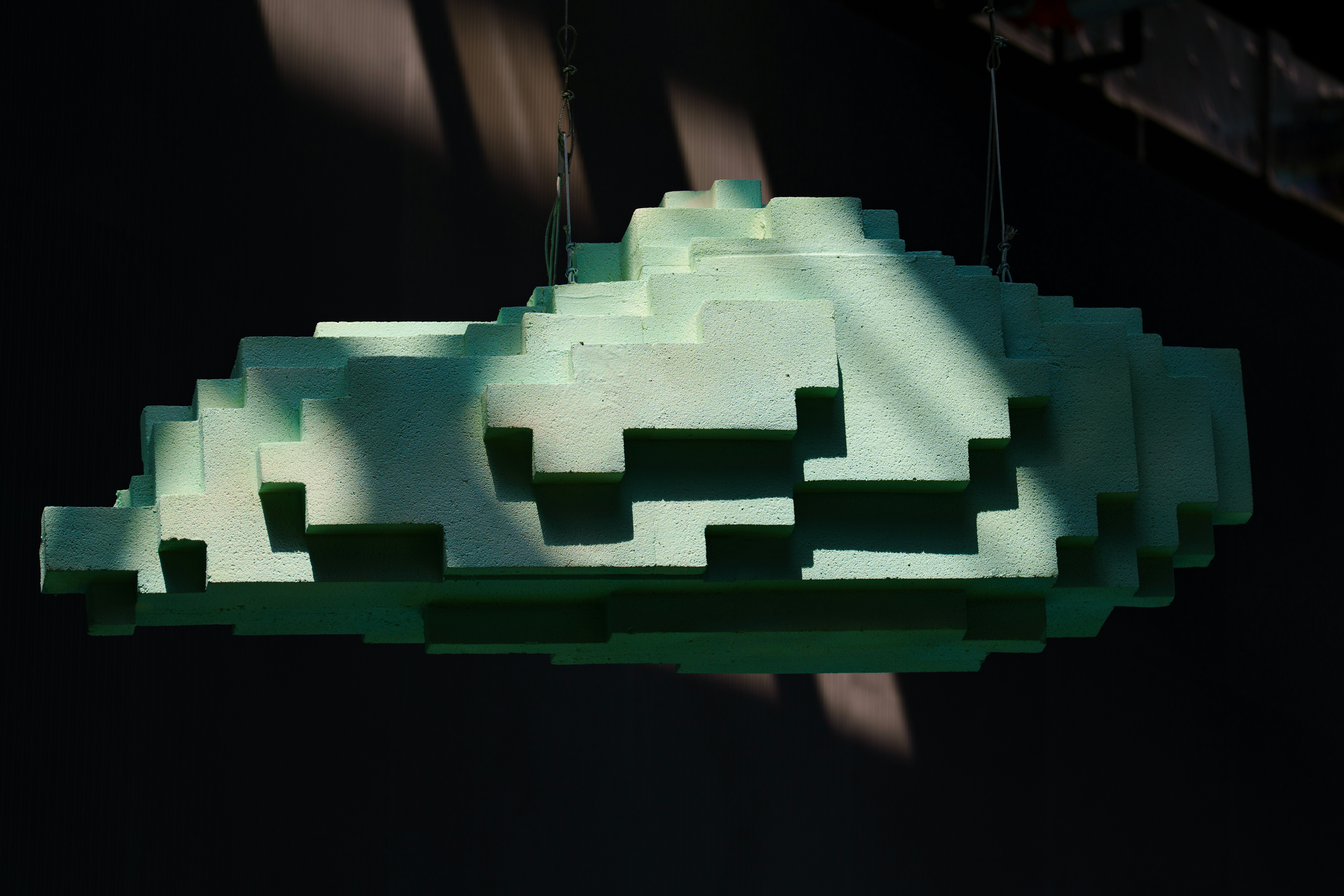 A pixelated cloud hangs from the ceiling.