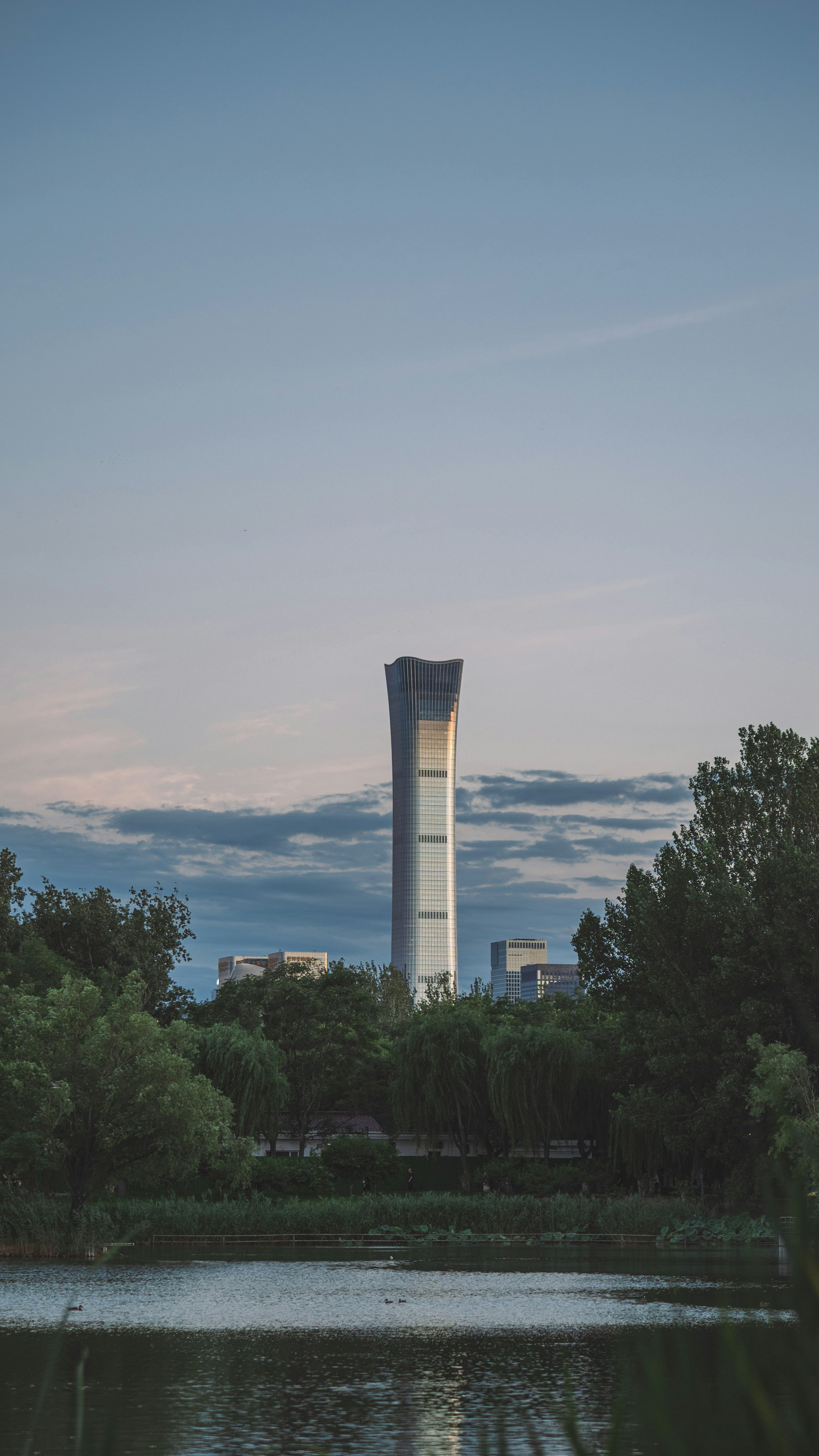 Urban Sentinel: The Towering Icon Amidst Nature