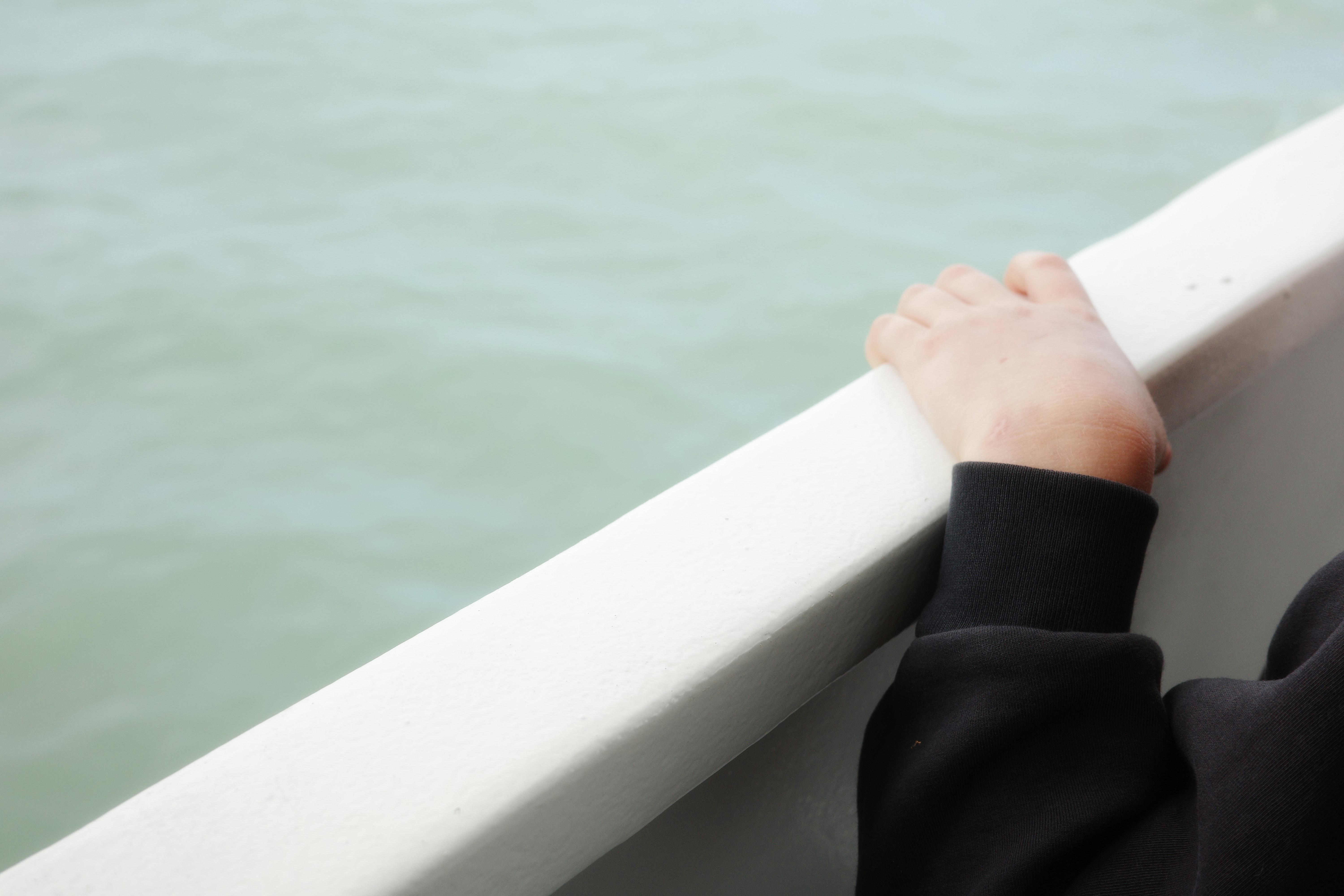 Gripping the Edge: A Quiet Moment Aboard