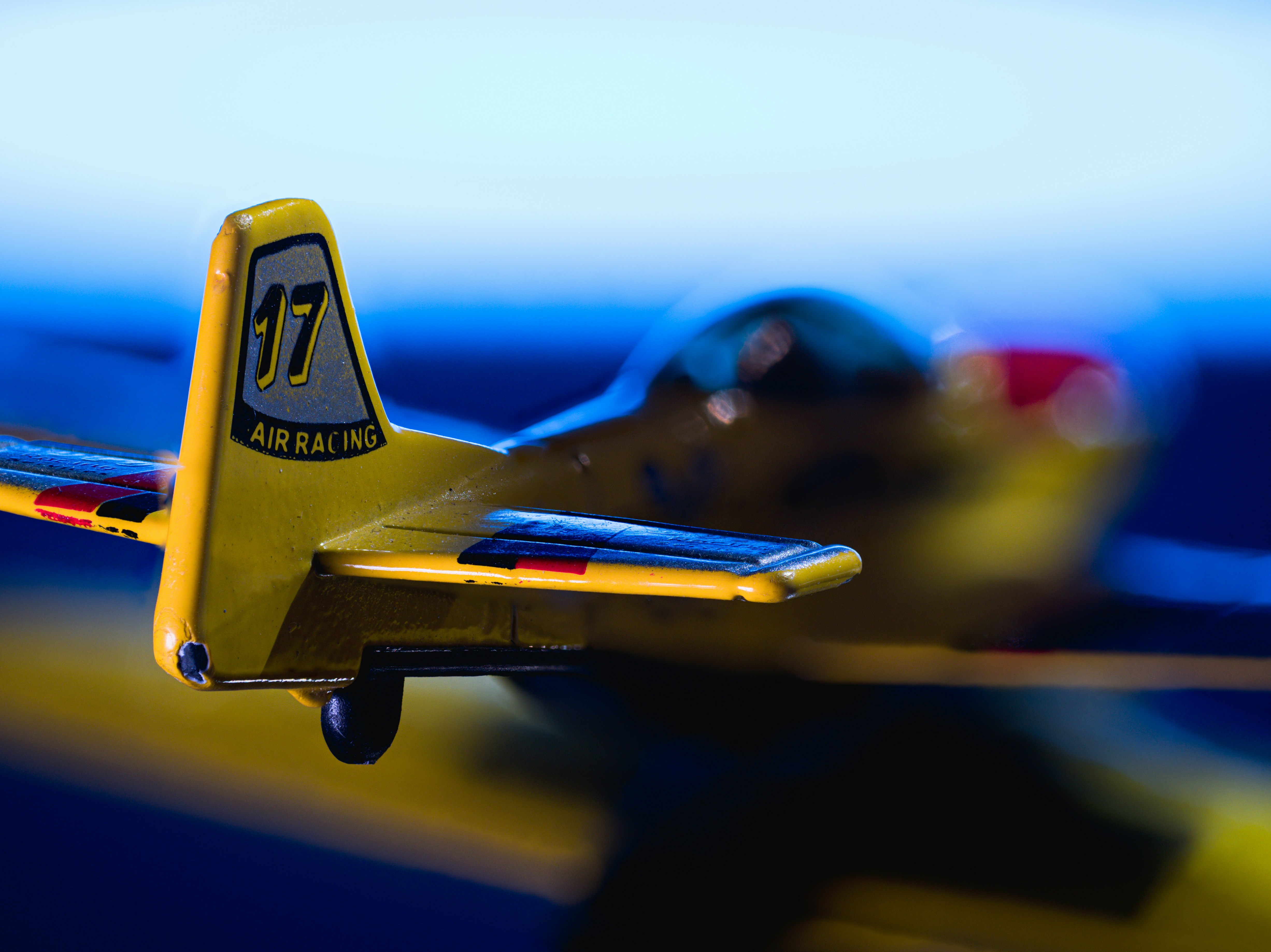 Tail-Number Promise: A Yellow Air Racer Reaches Toward the Horizon