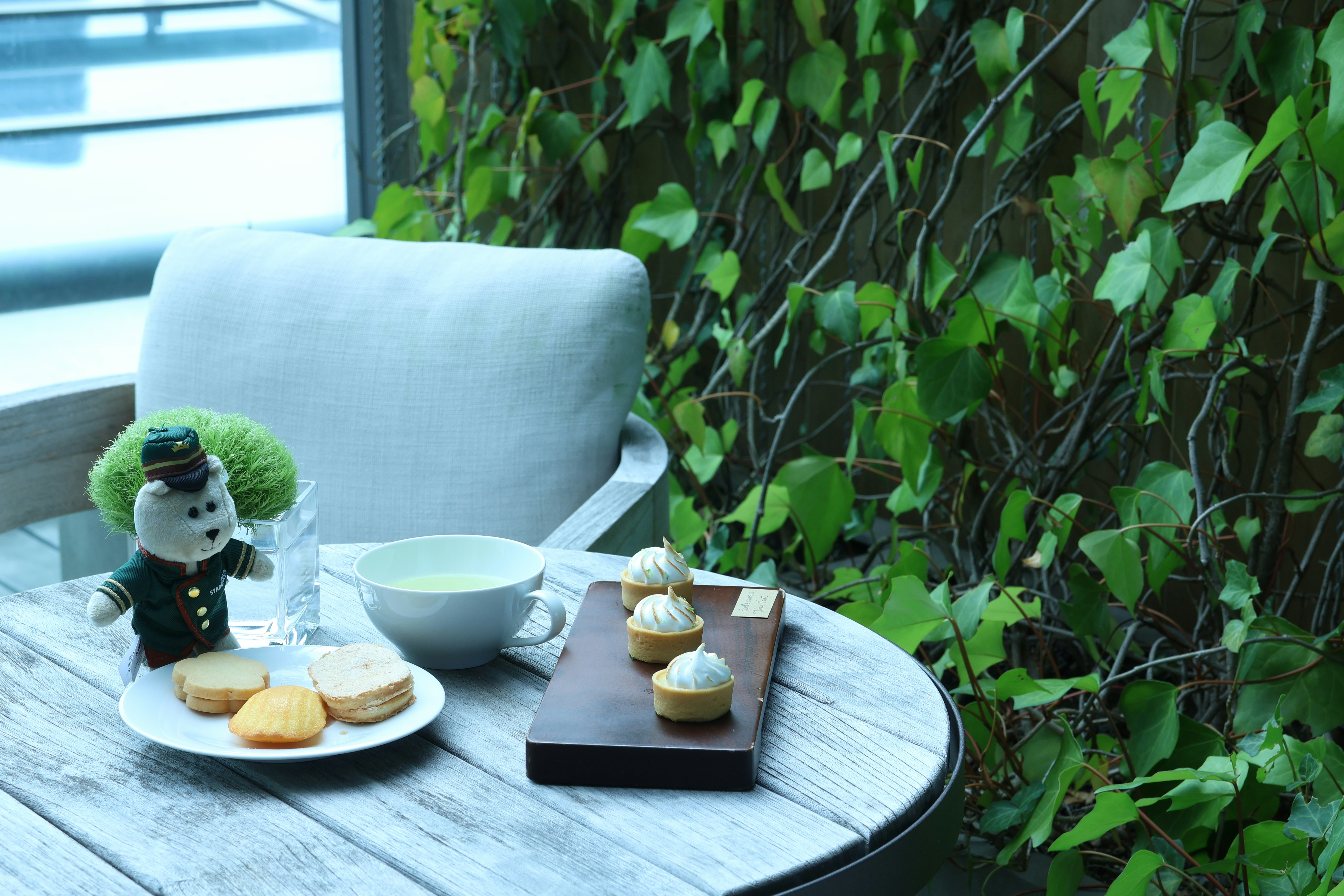 A cozy table with treats and drinks.
