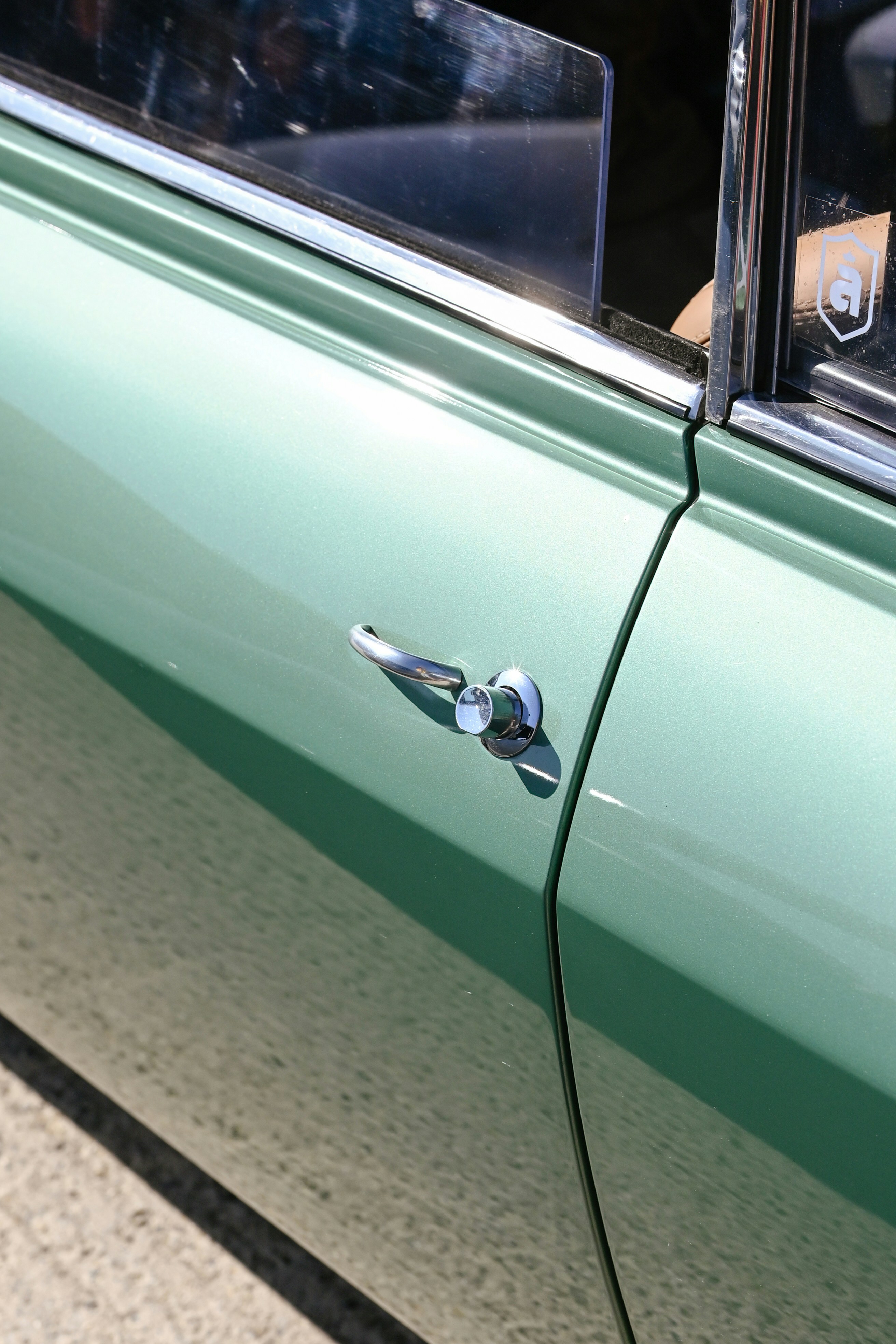 Cars & Coffee (Sat 12th July | A close-up view of a vintage car door.