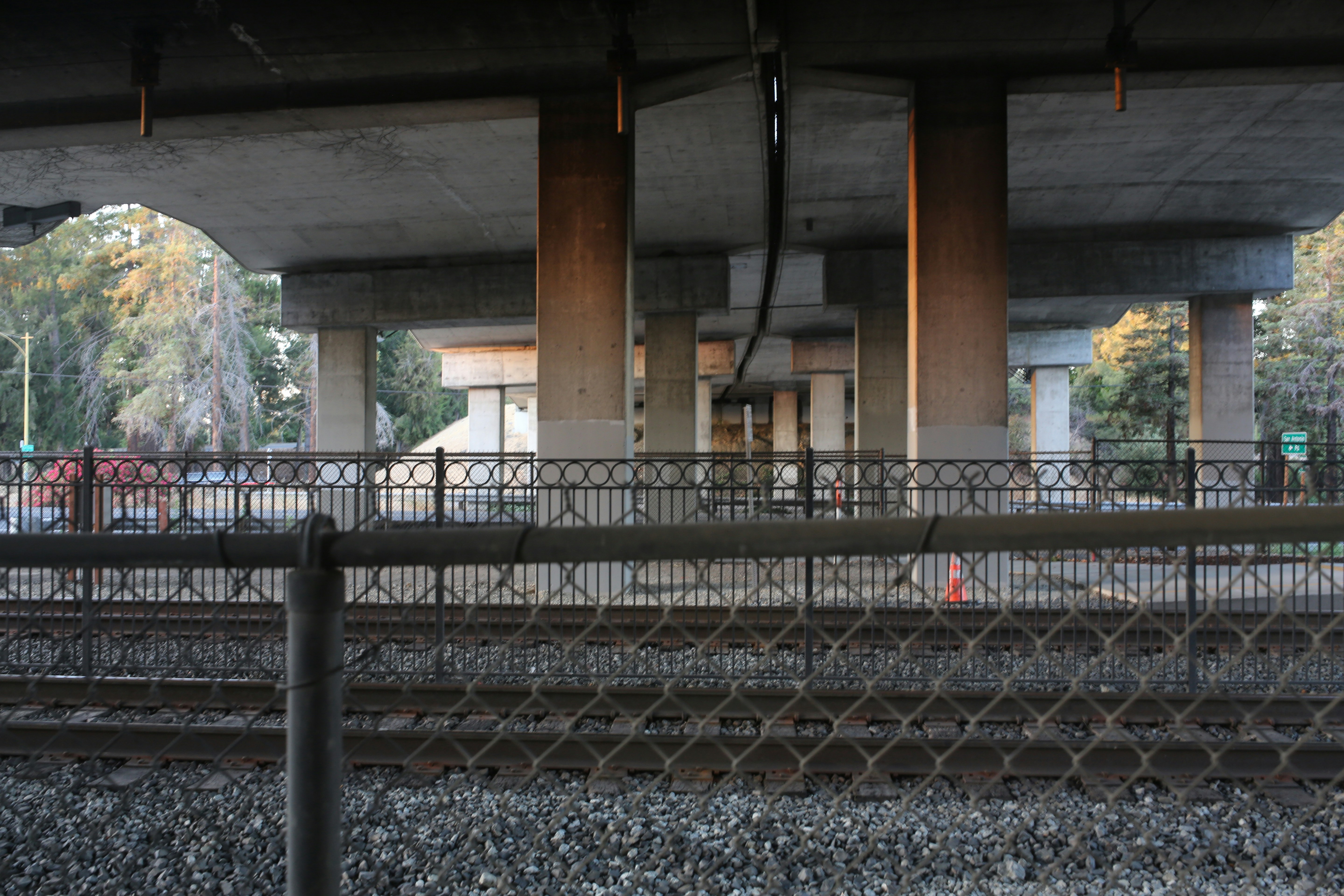 Underneath a bridge, with train tracks in view. photo – Free Building ...