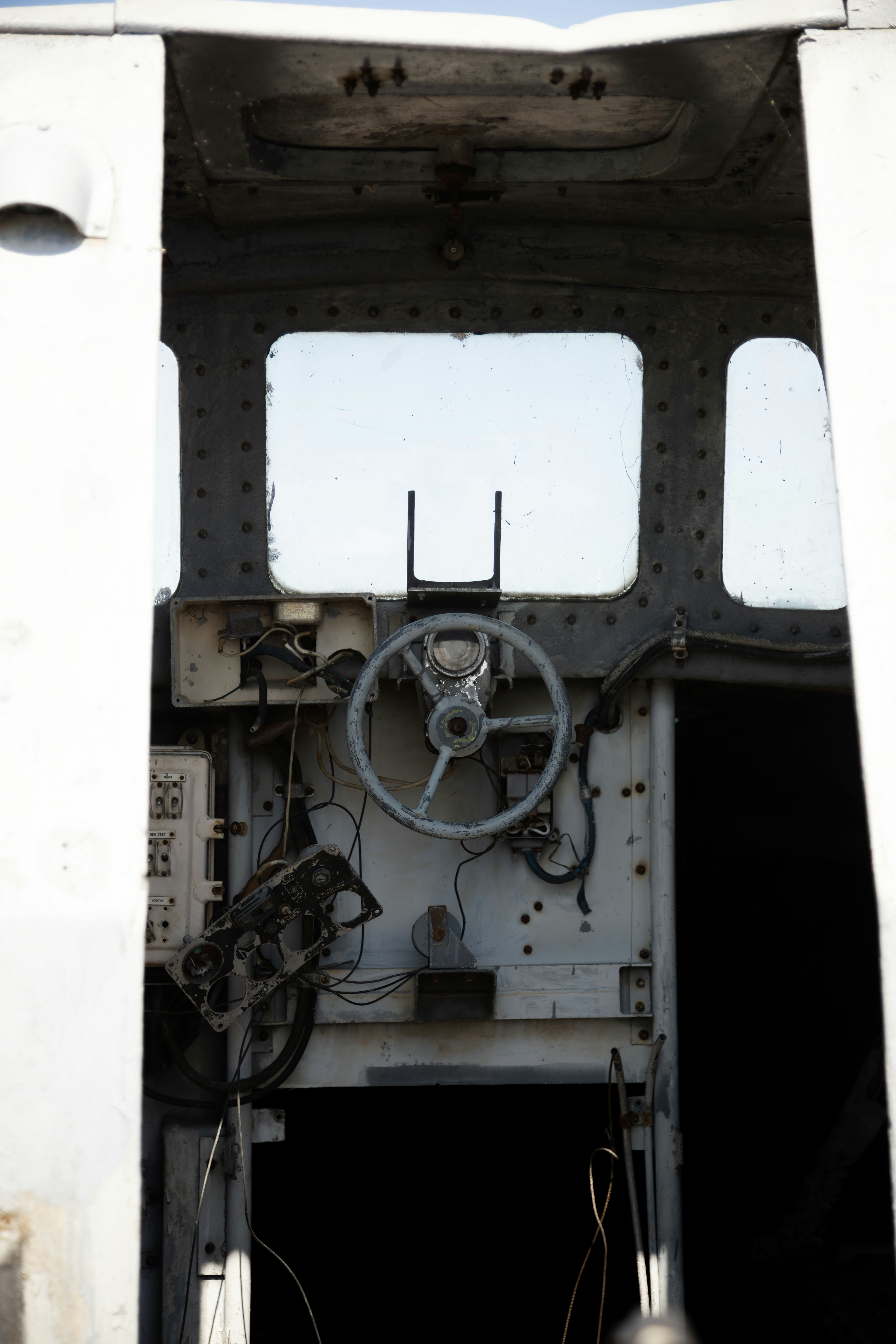 Kronstadt, Russia | The cockpit of an old, weathered vehicle.