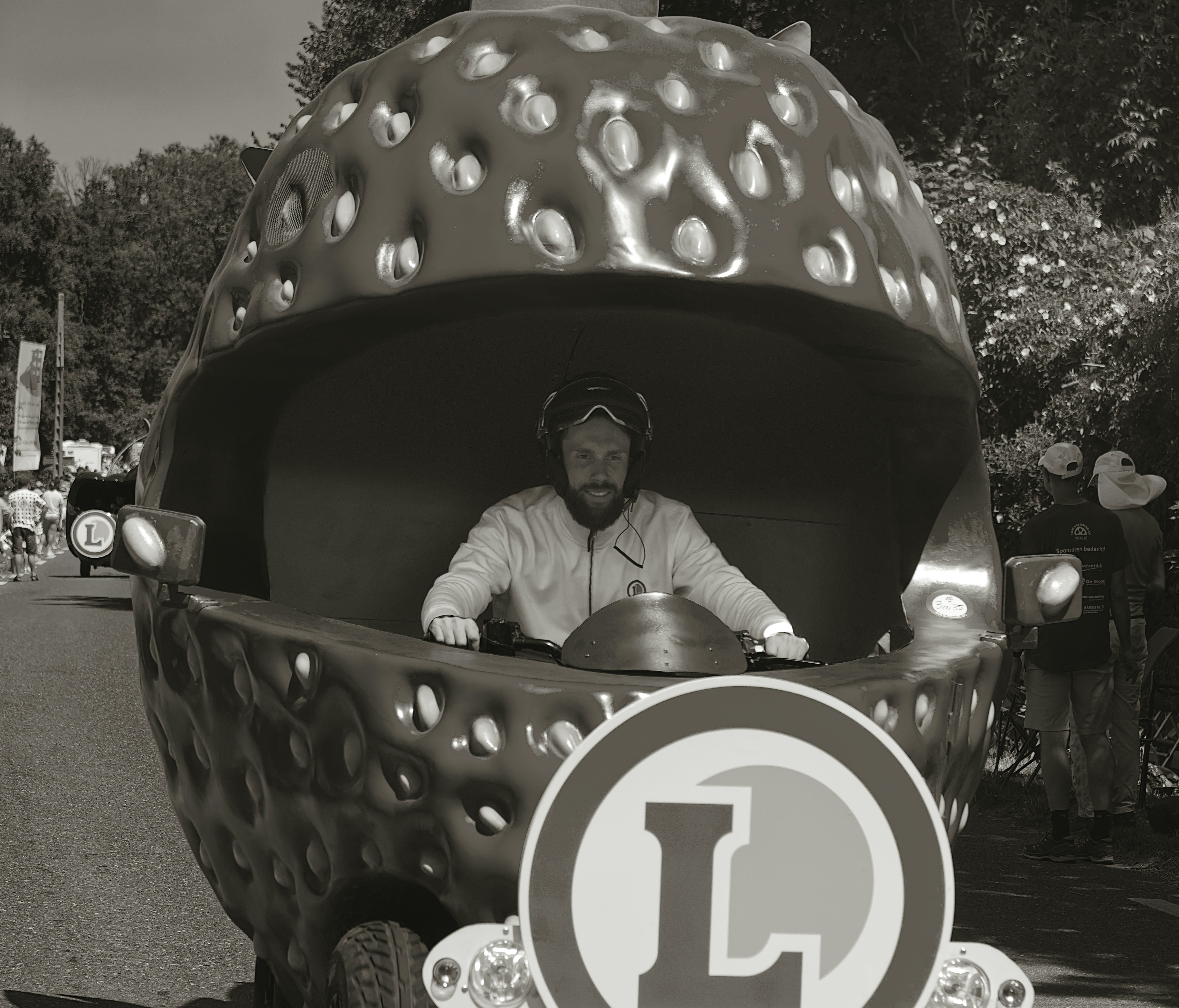 Heads-Up in a Strawberry-Shell Vehicle at a Street Festival