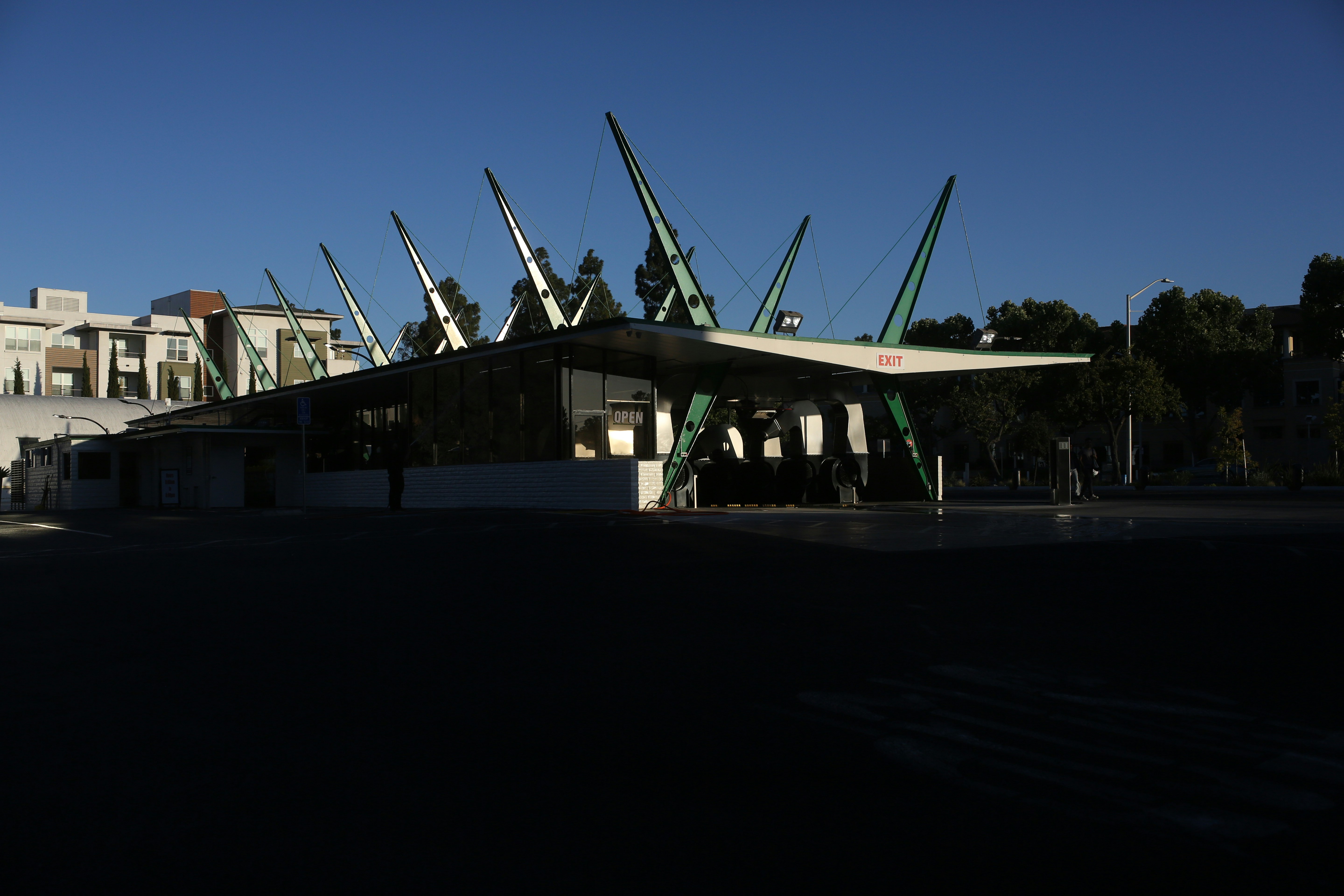 A unique building's angular roof stands out.