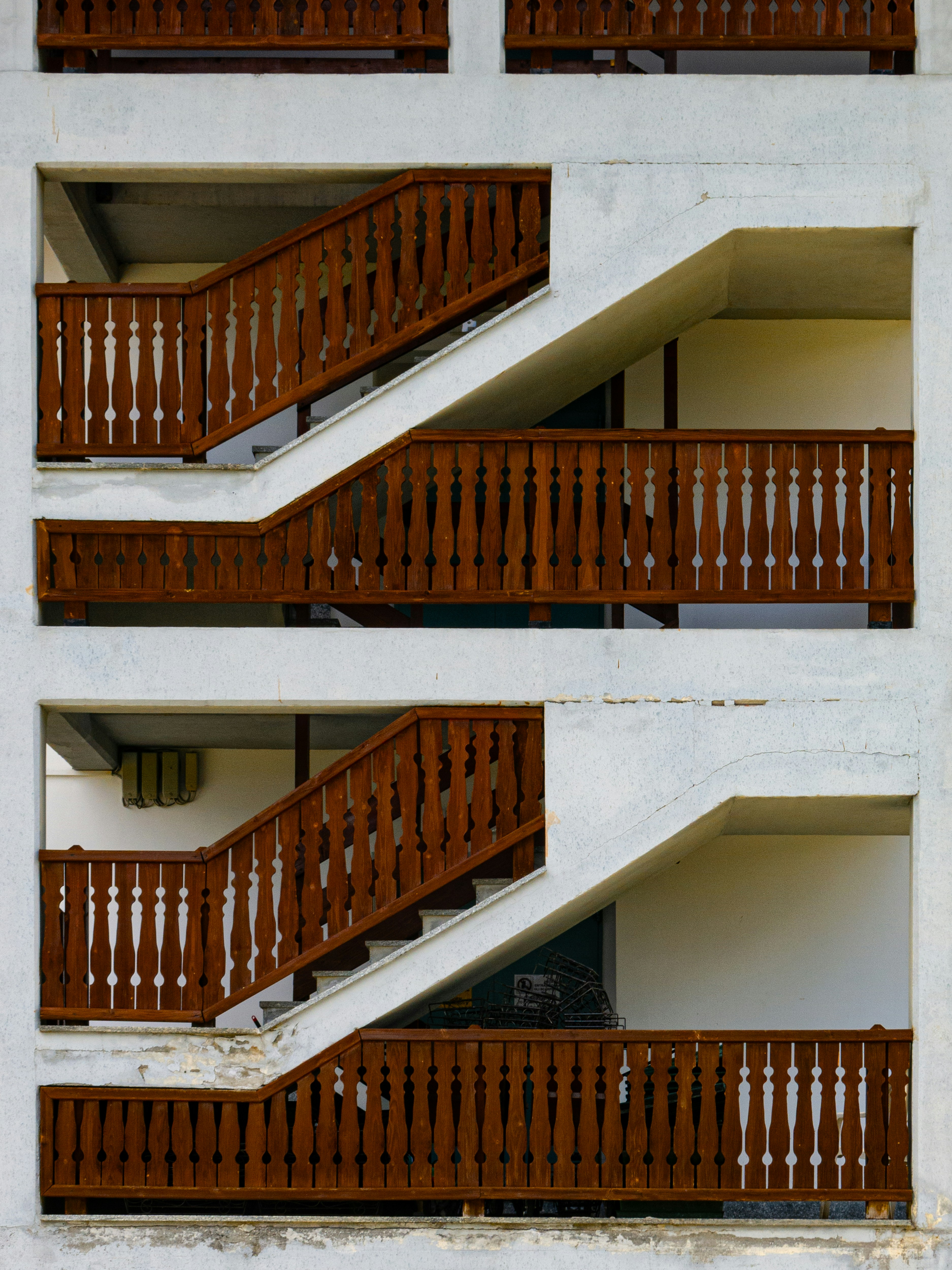 Exterior stairs and railings on a building's facade.
