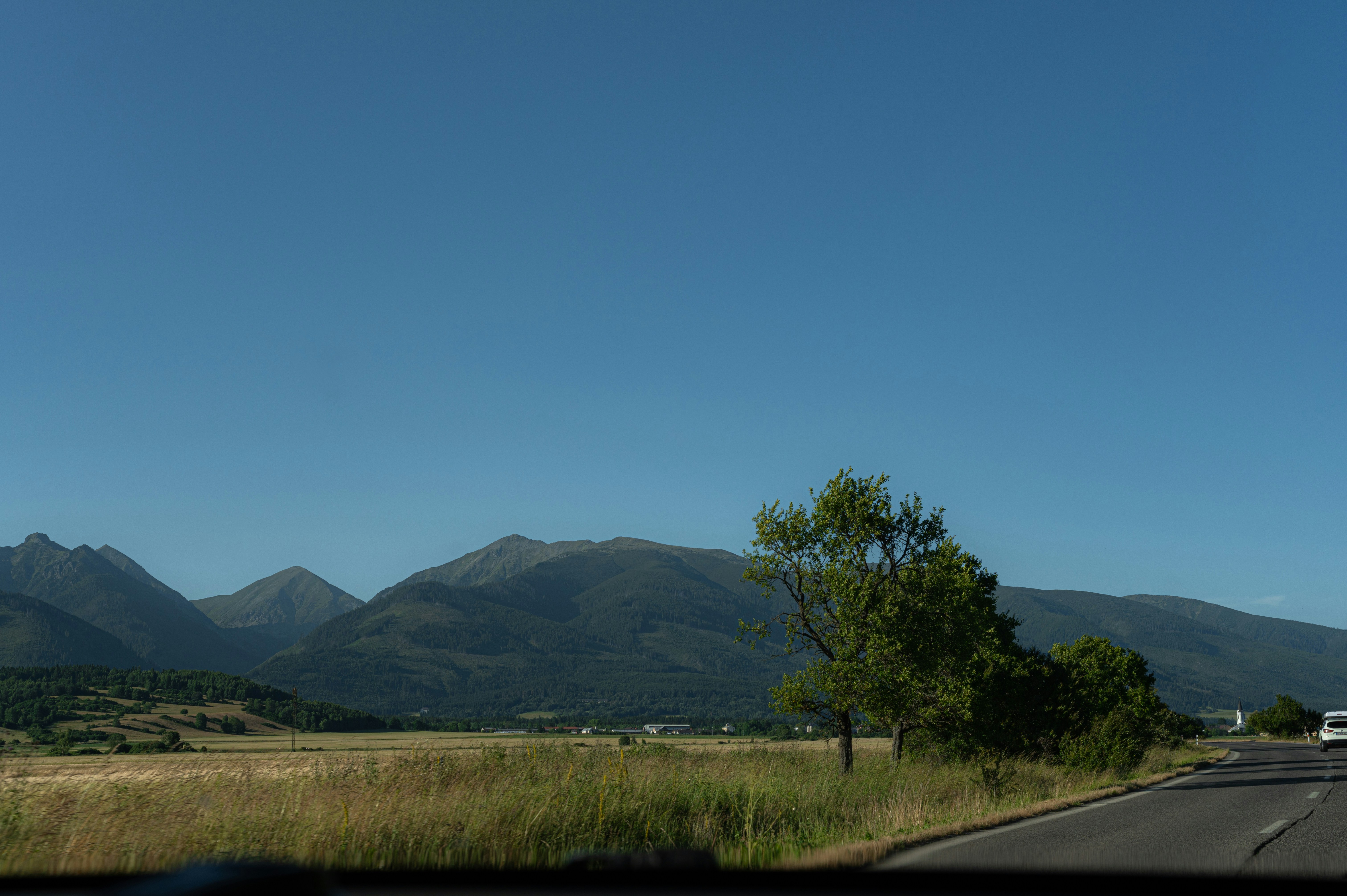Open Highway toward a Quiet Mountain Horizon