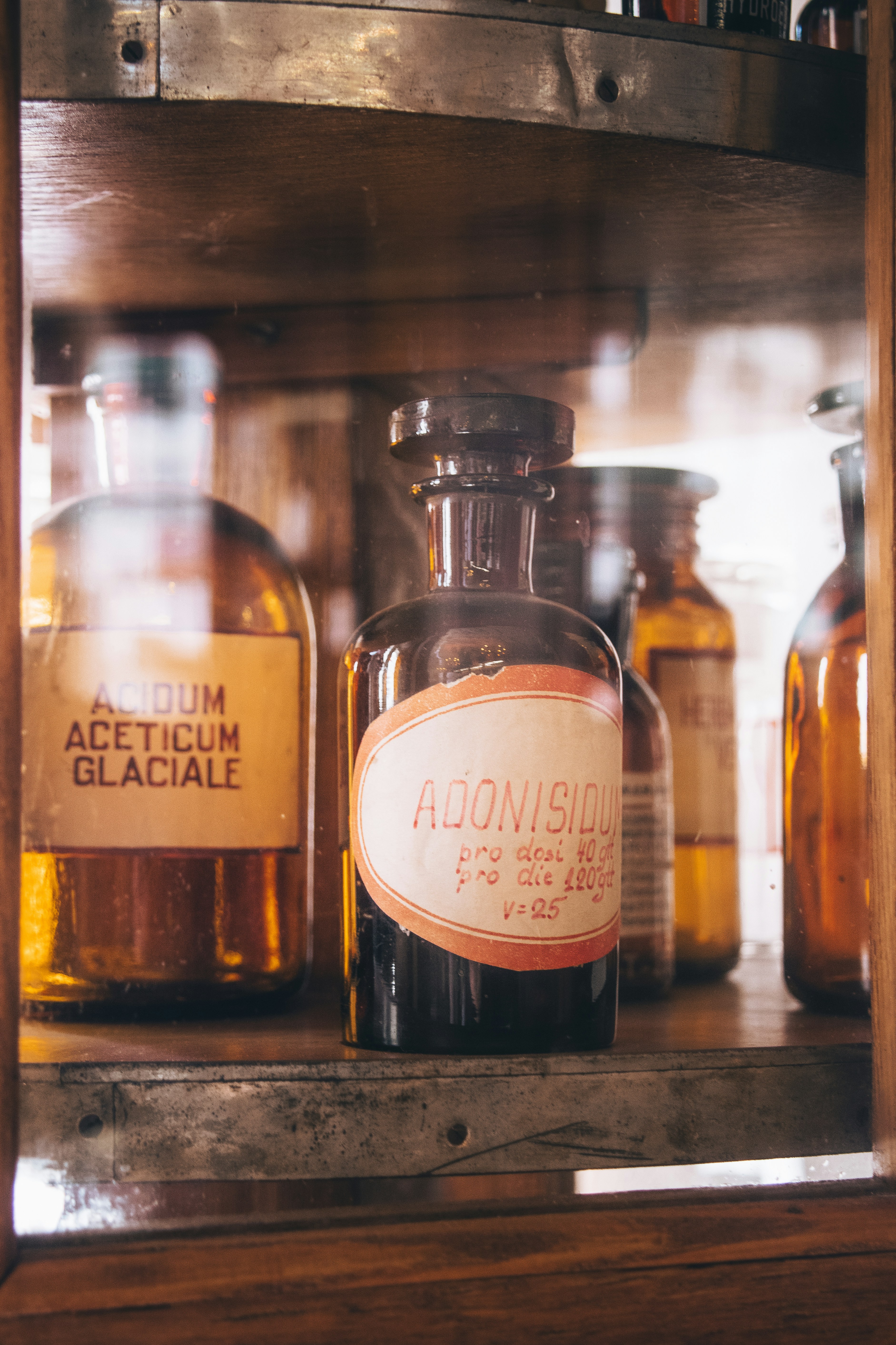 Amber Echoes in a Vintage Apothecary Shelf