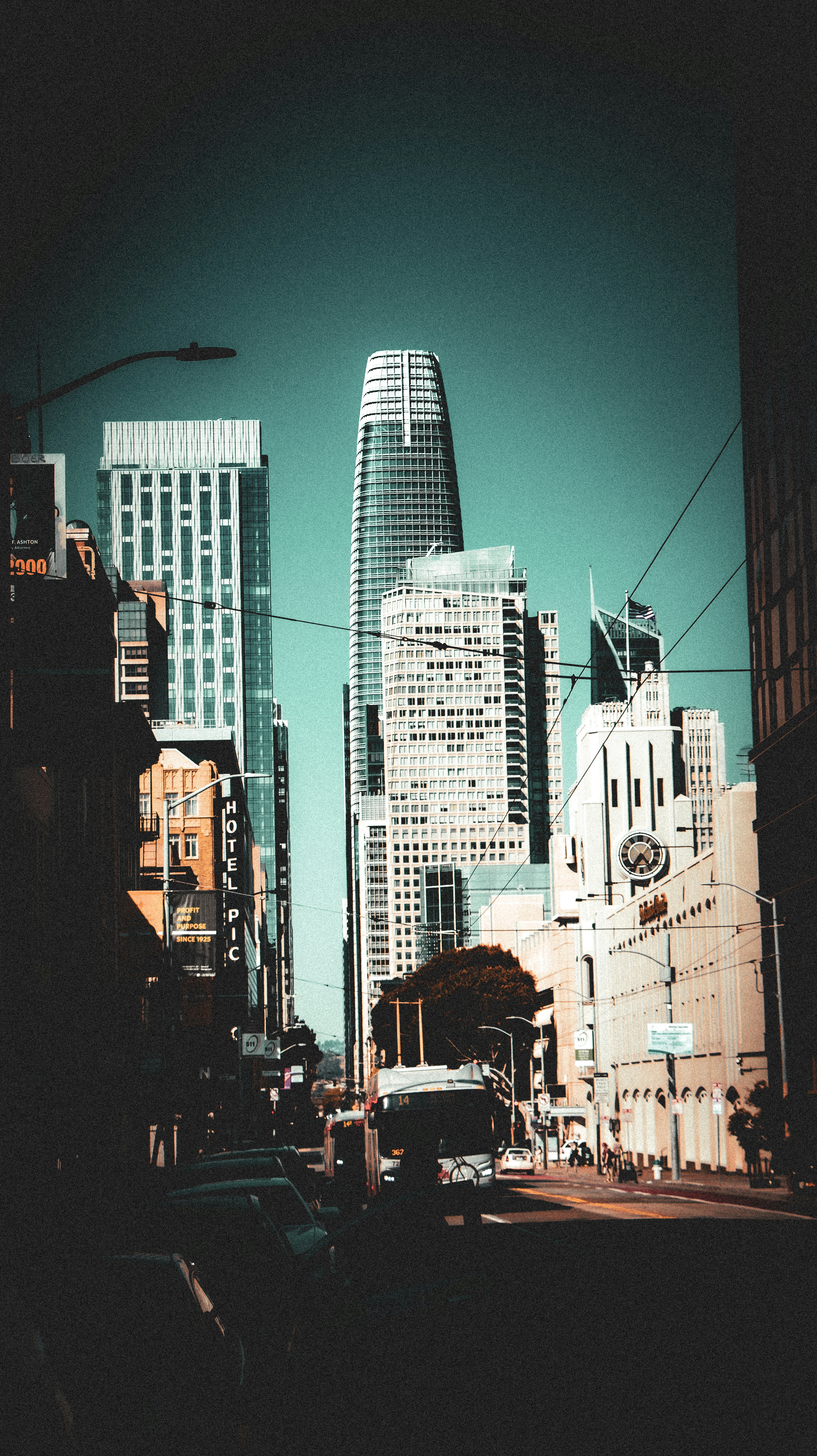A city street view with skyscrapers in the background.