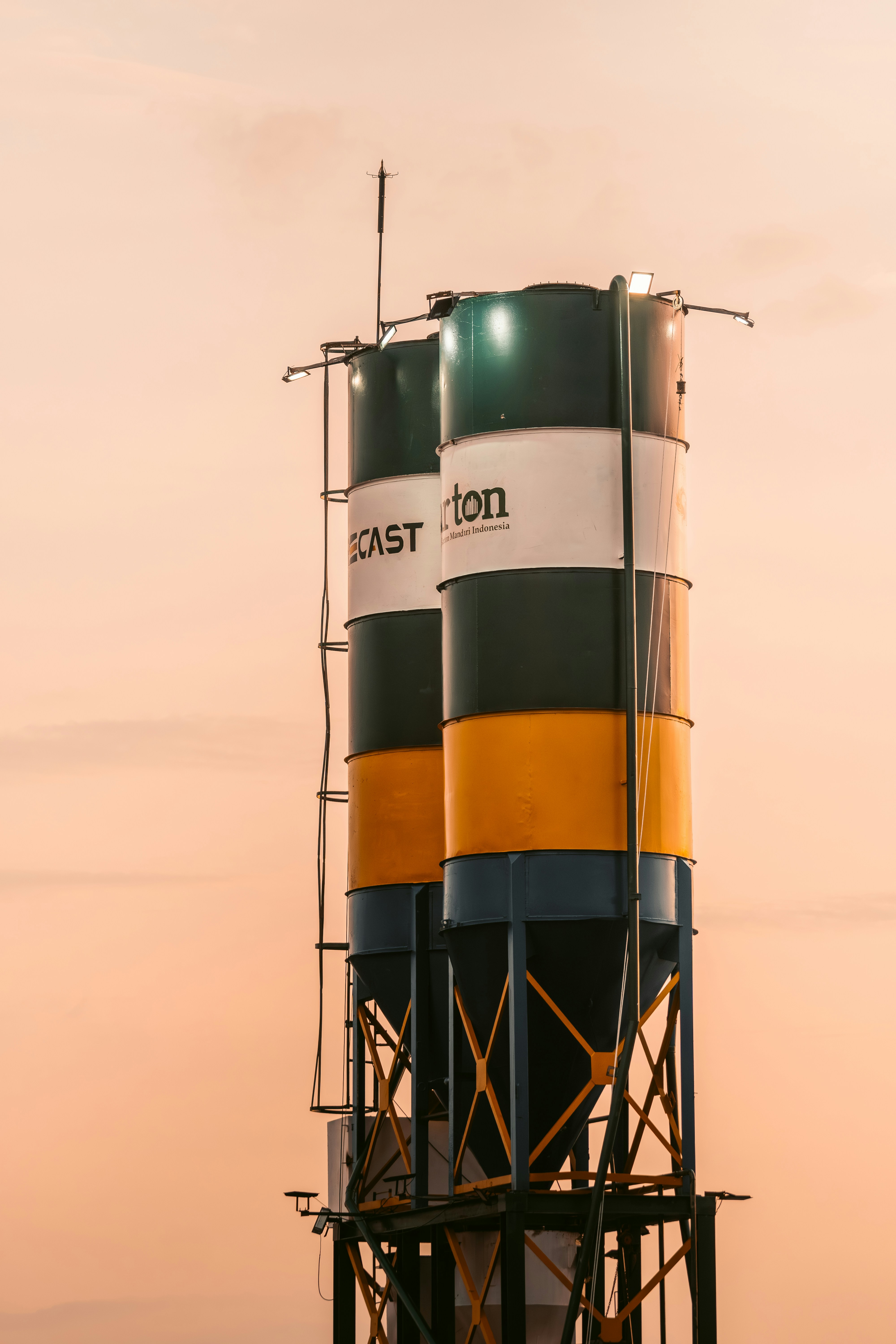Industrial Elegance: Silos Against a Soft Sunset