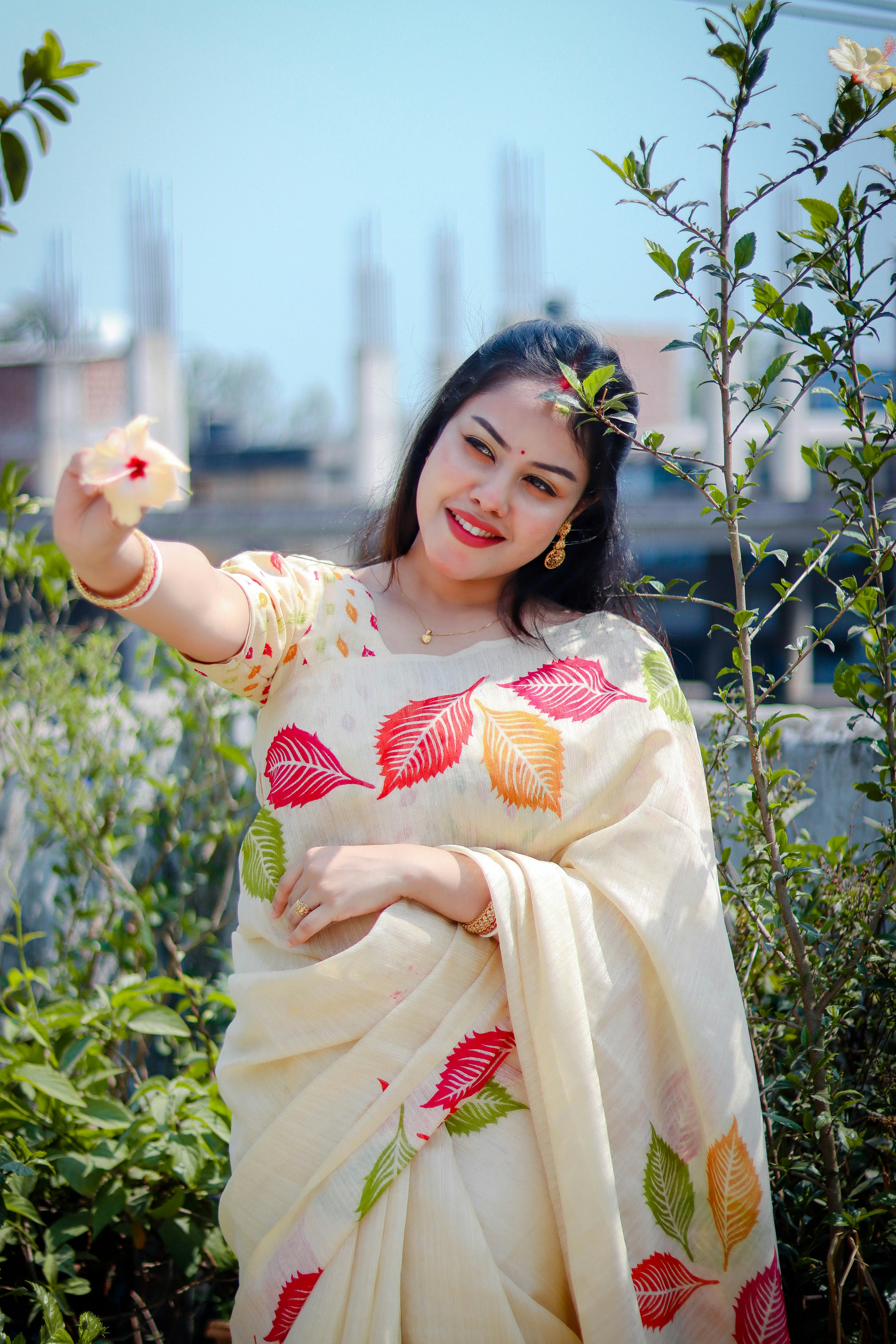 Floral Grace: A Sunlit Portrait Among Blossoms