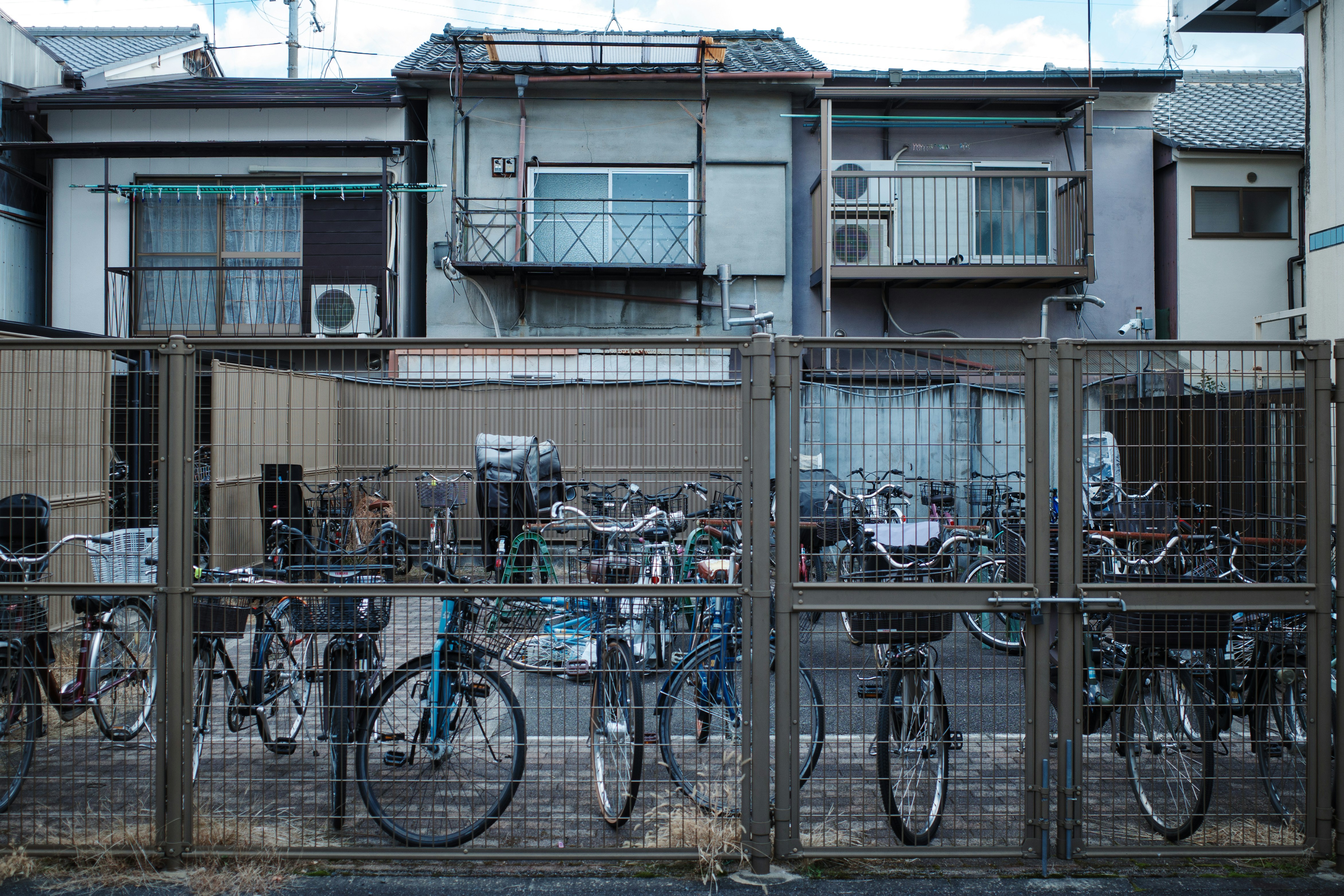 Urban Bicycle Haven Behind the Fence
