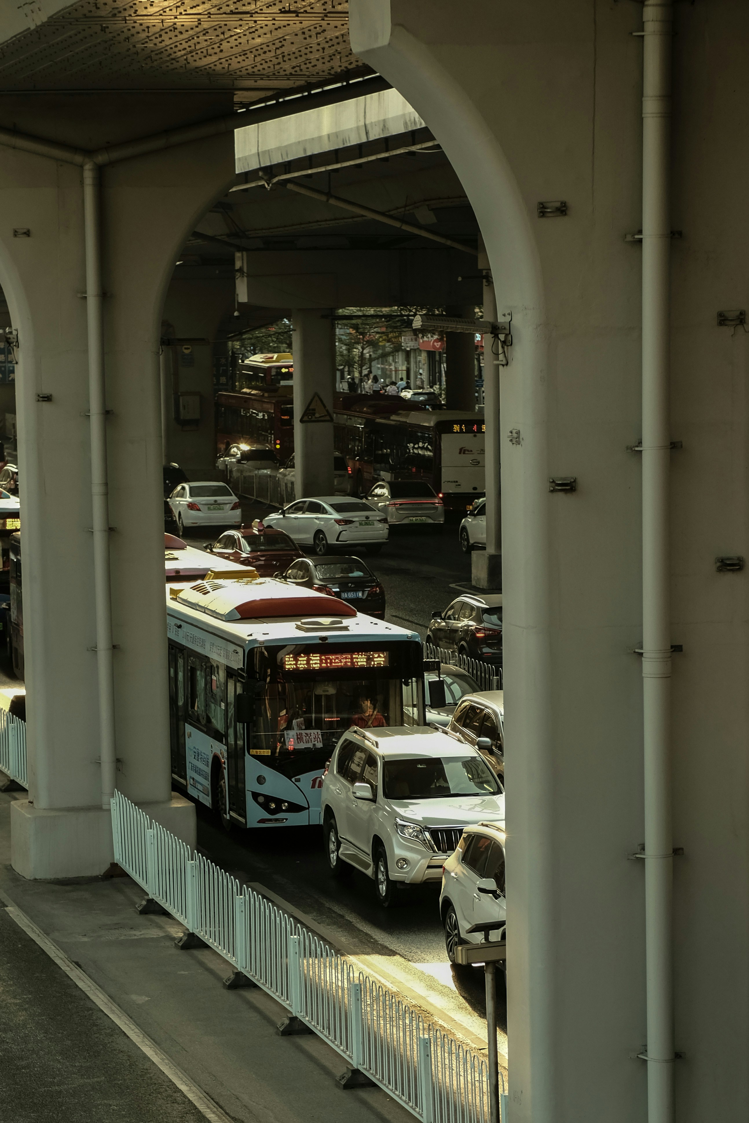 Traffic congestion is seen under a bridge.