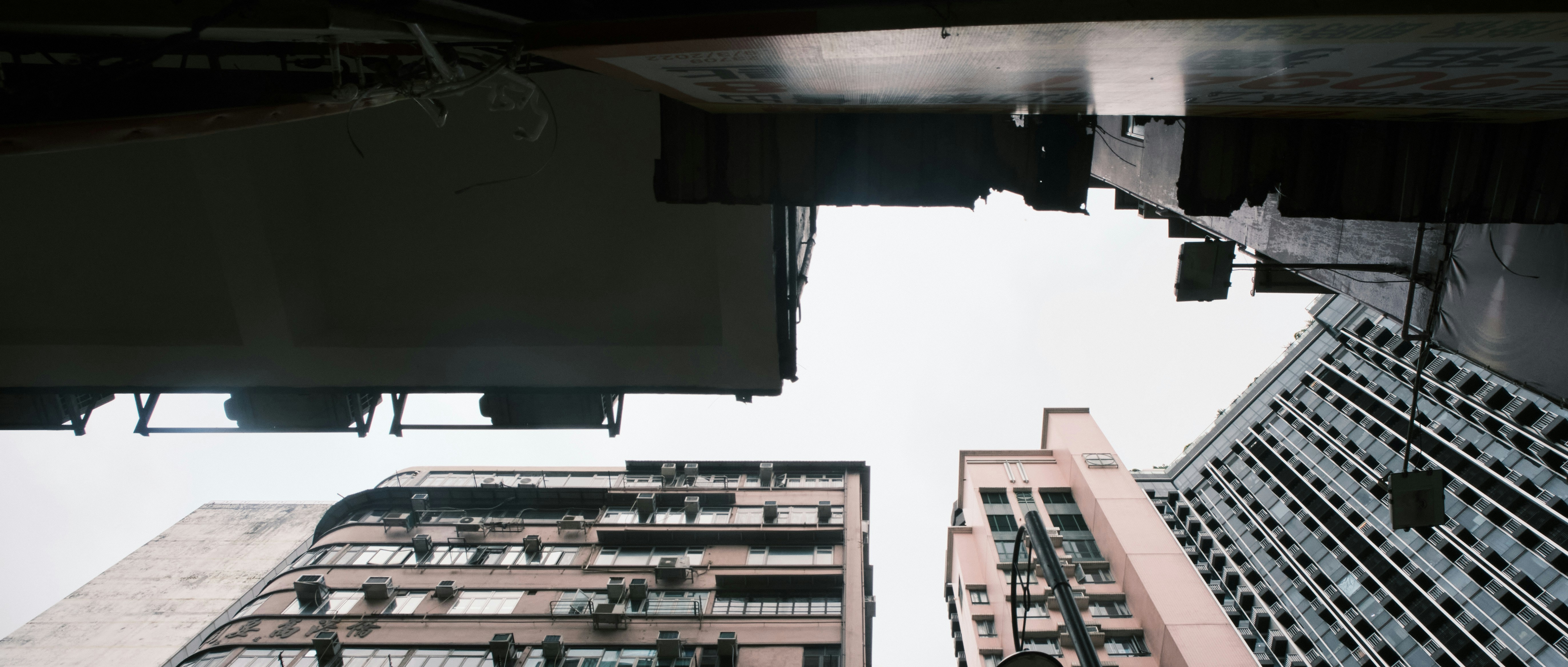 Buildings are seen from a low-angle perspective.