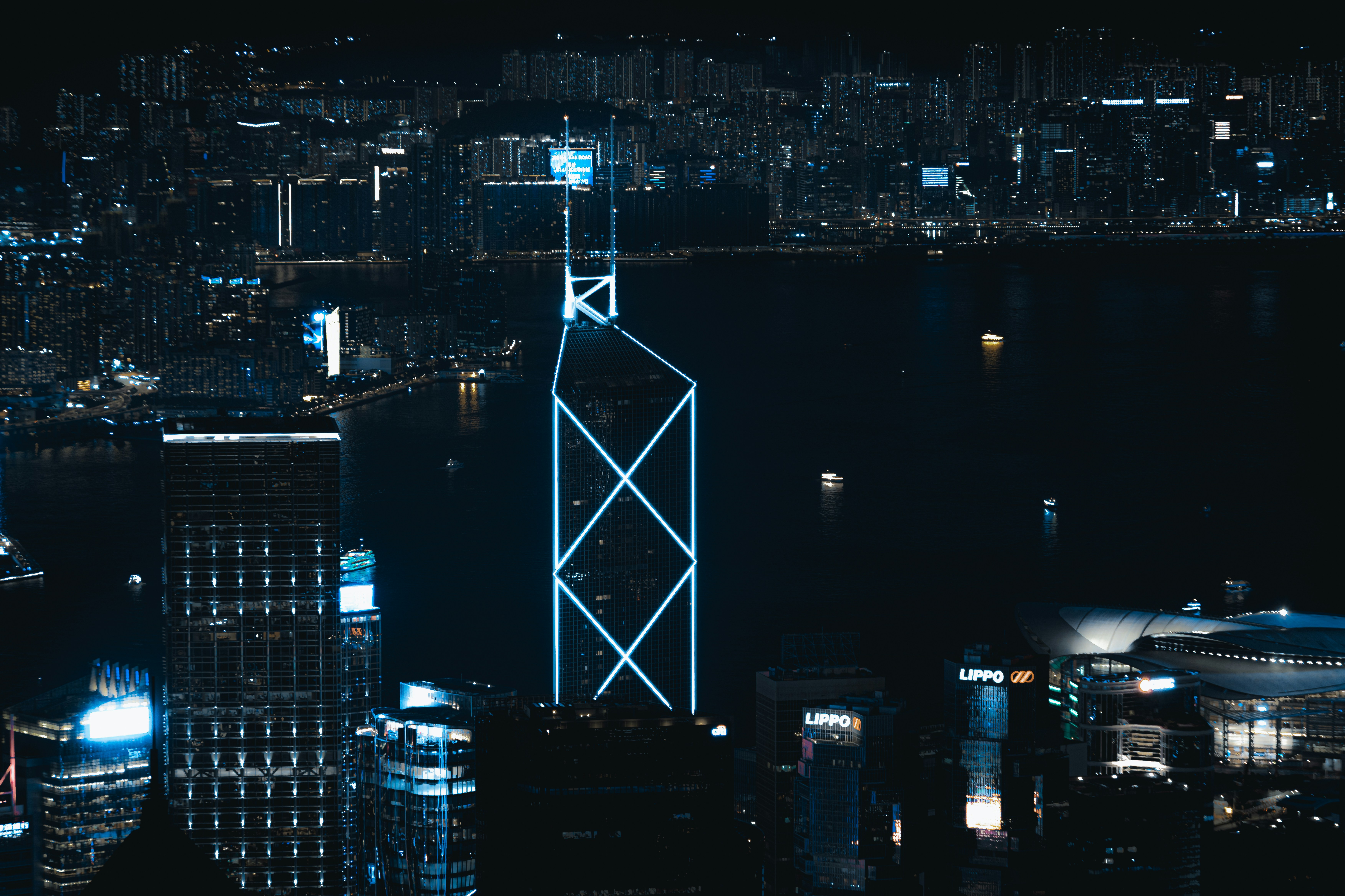 City skyline lights up at night.