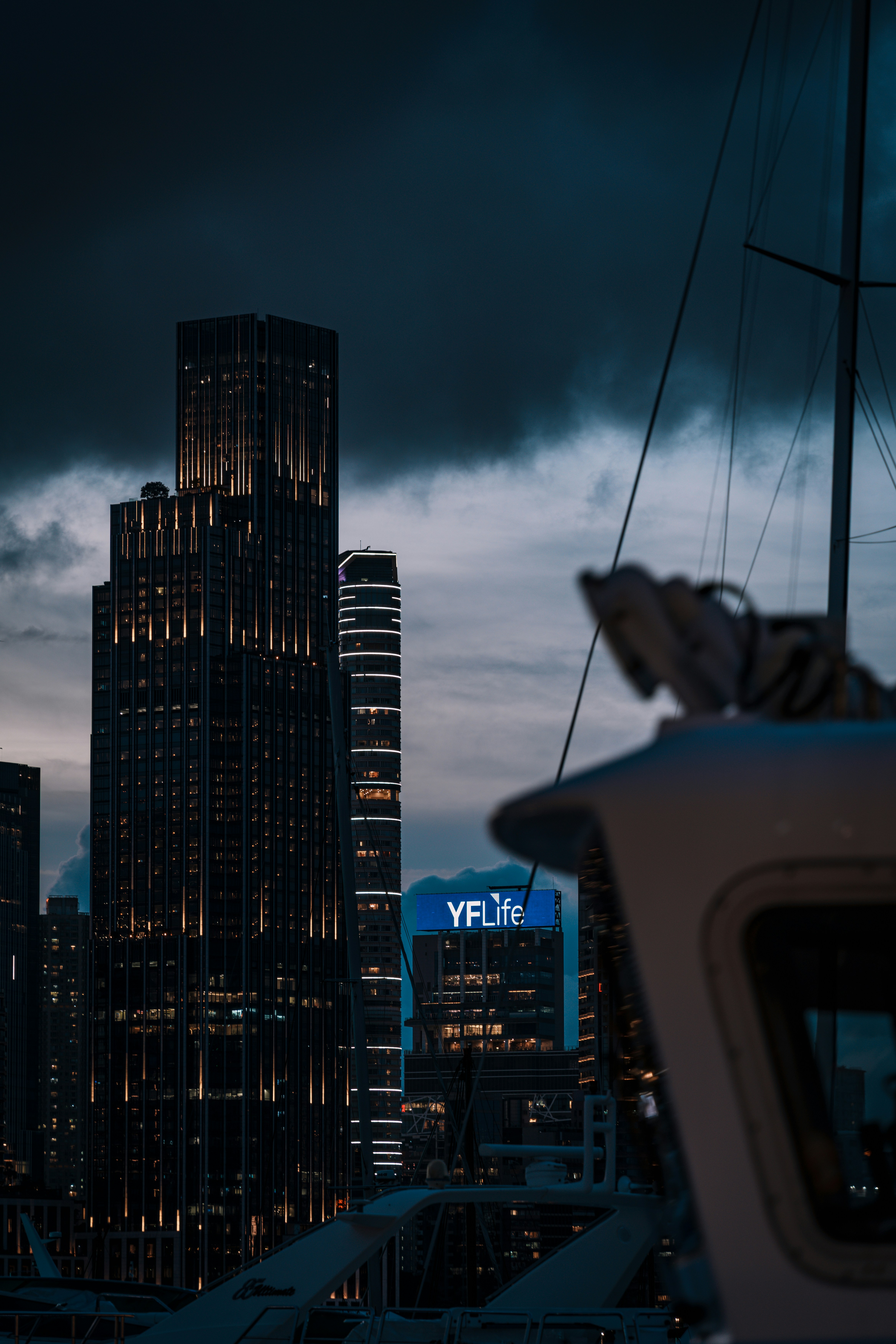 Dark cityscape lit up at dusk.