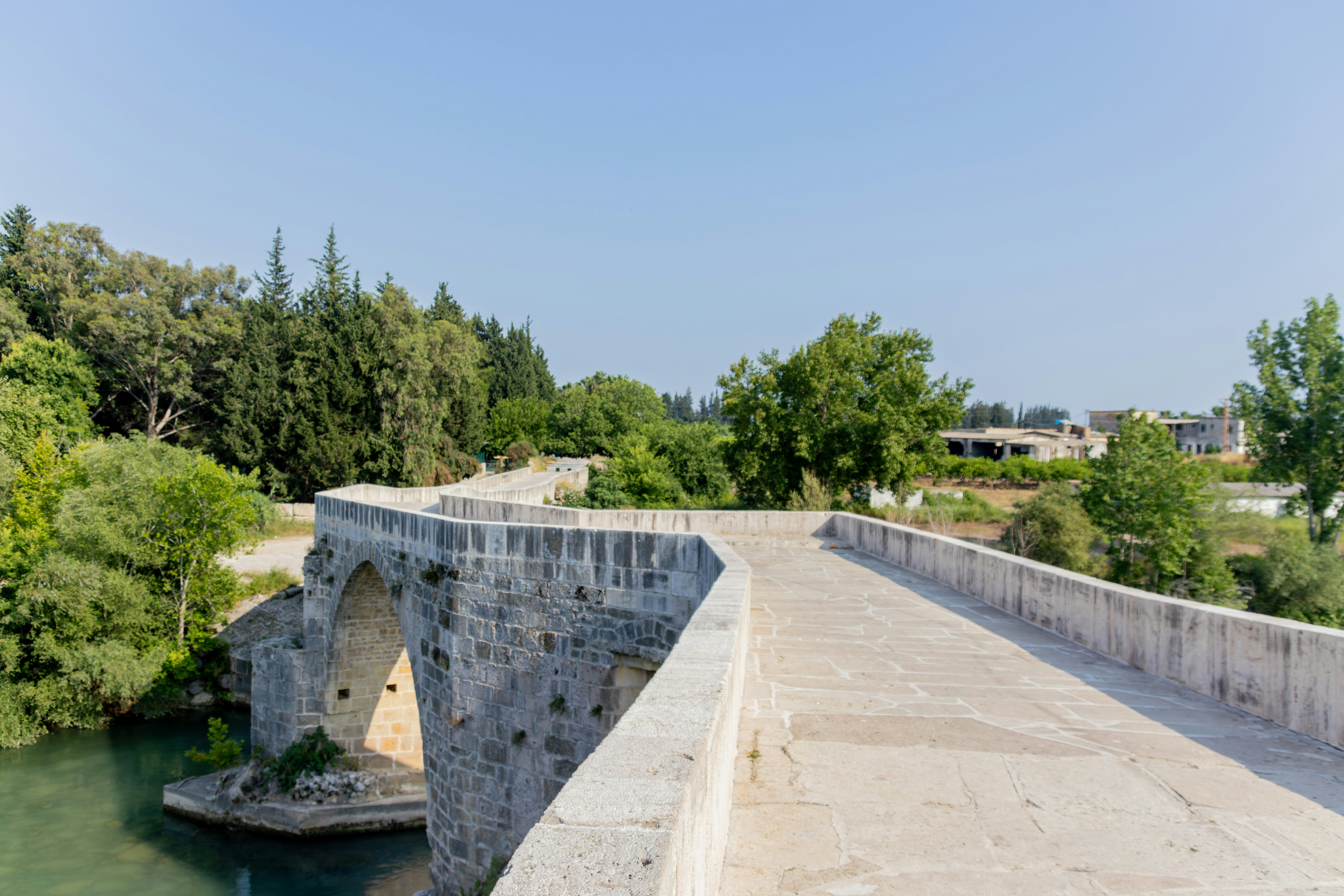 Bridge | An ancient stone bridge arches over a river.