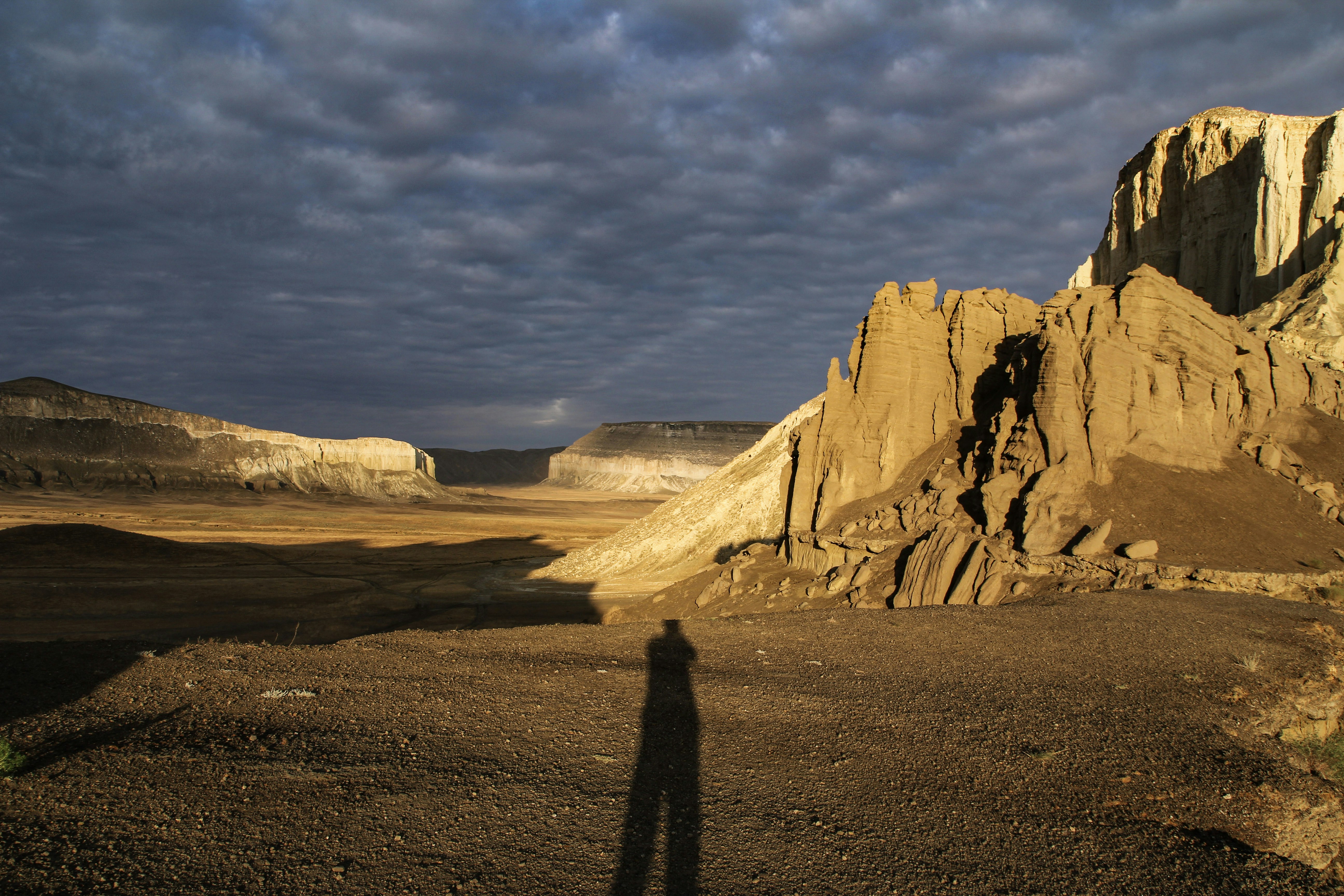 Lone Shadow Across a Desert Monolith