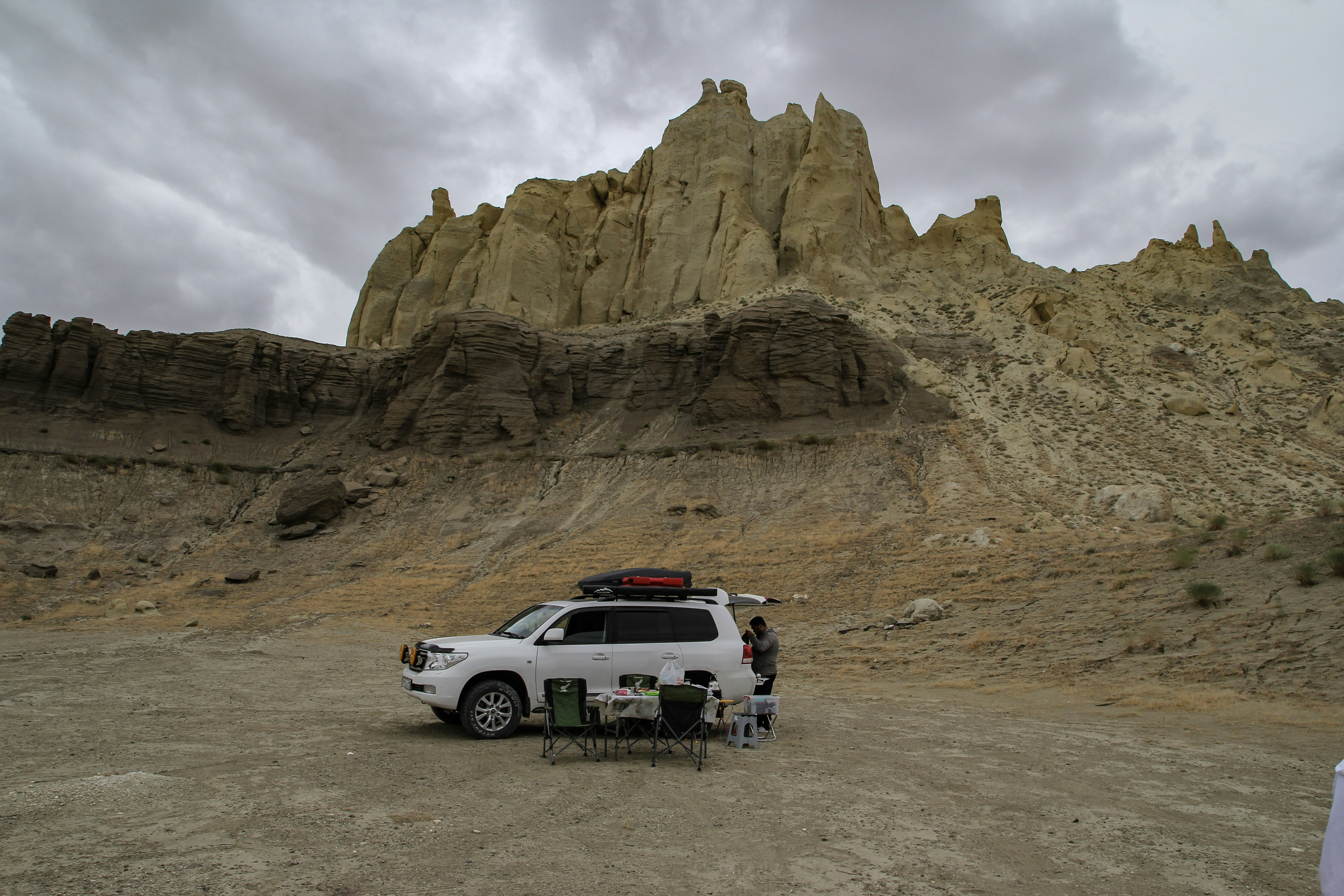 Desert Outpost: A White SUV Camps by the Rugged Ridge