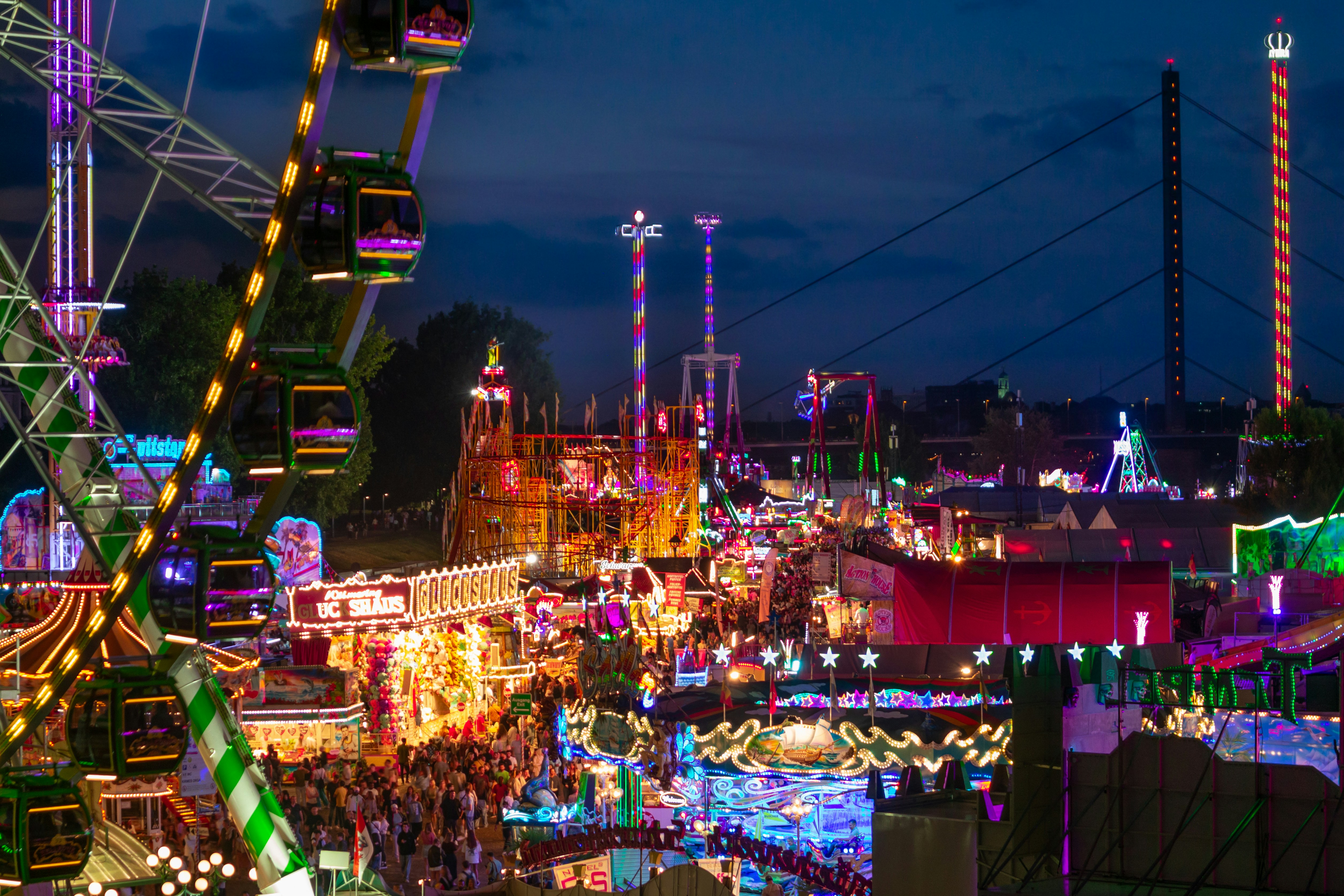 Rheinkirmes 2025 | An illuminated amusement park at night.