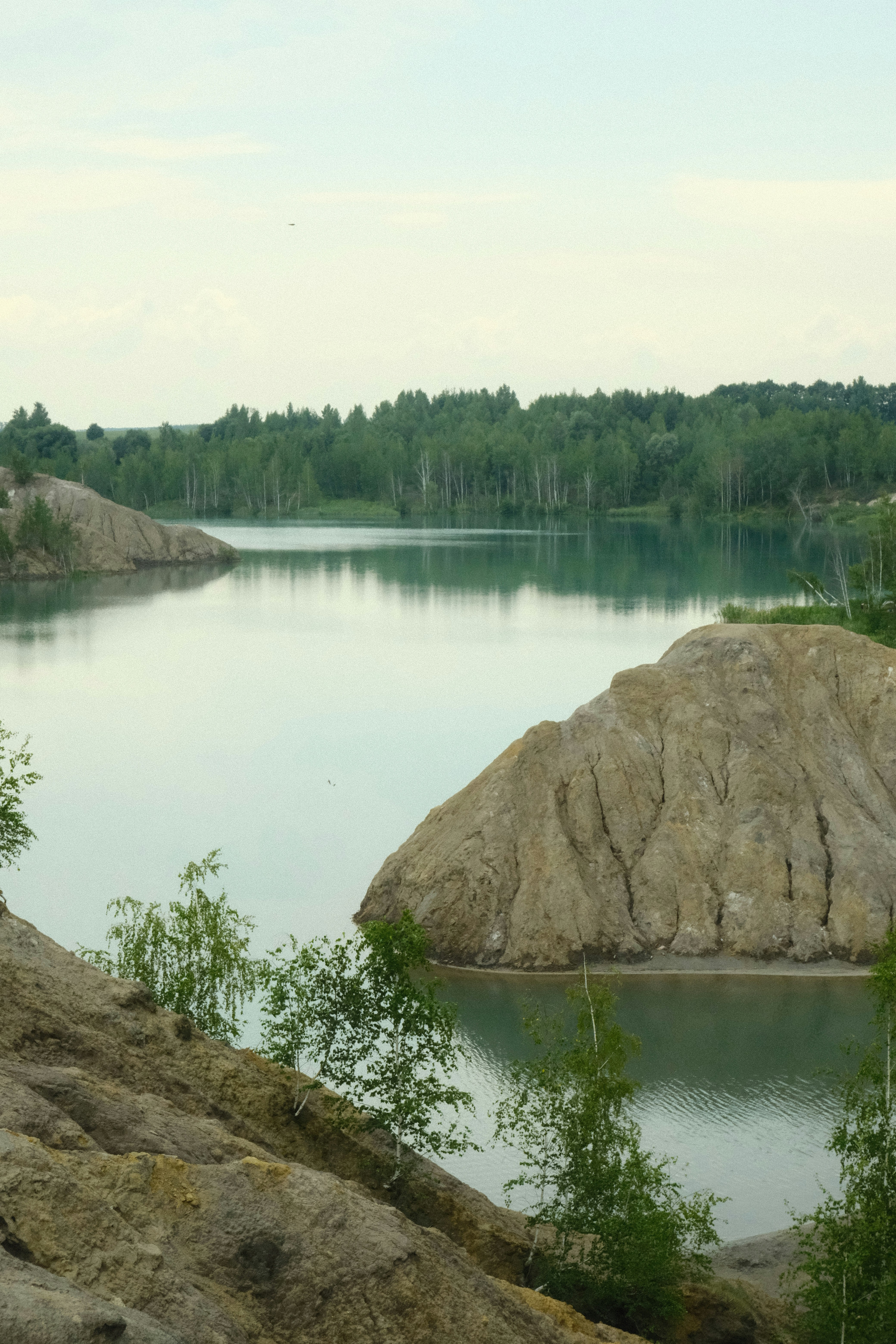 Scenic view of a calm lake surrounded by nature.