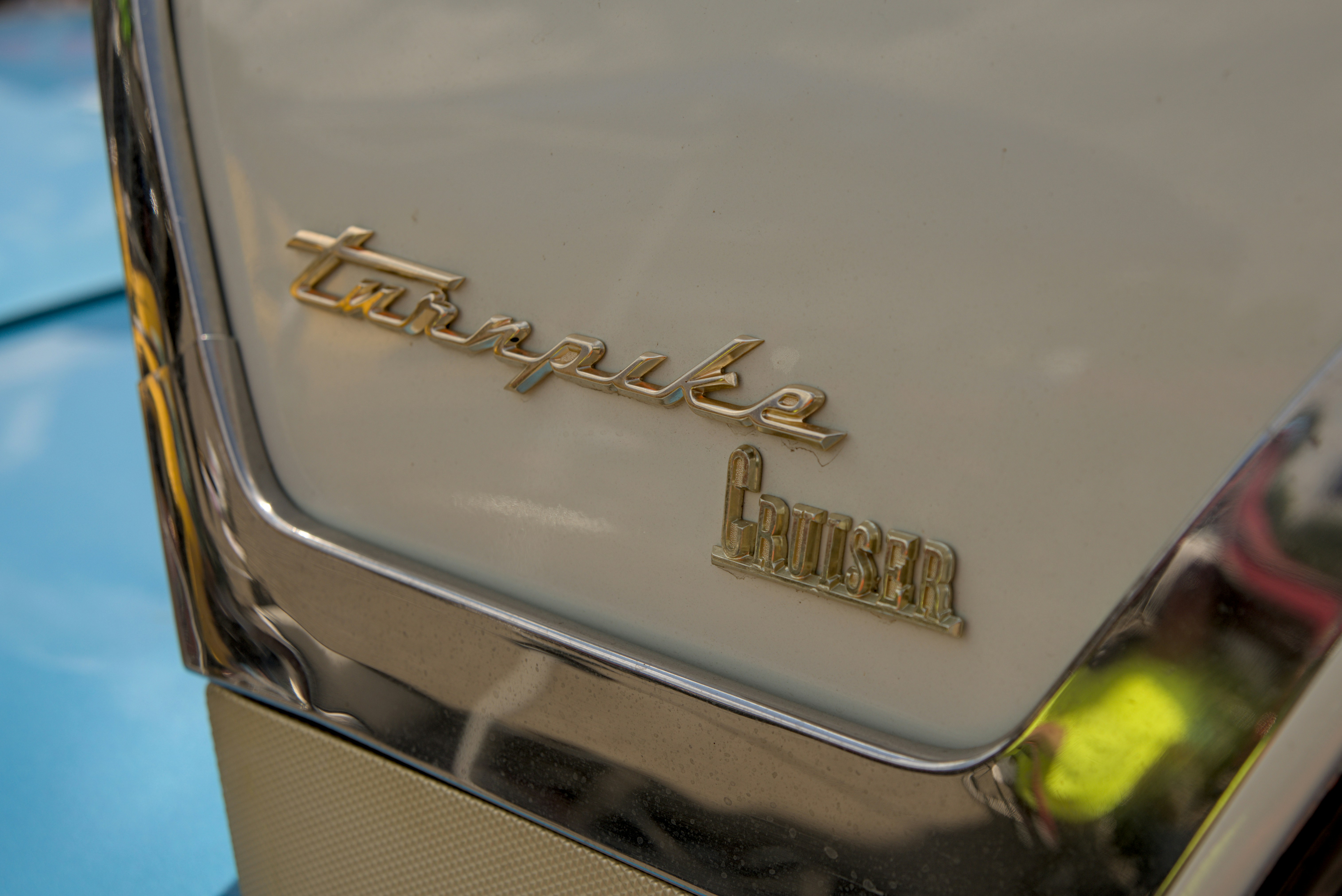 Close-up of the vintage Turpike Cruiser emblem, showcasing its classic design and chrome detailing.