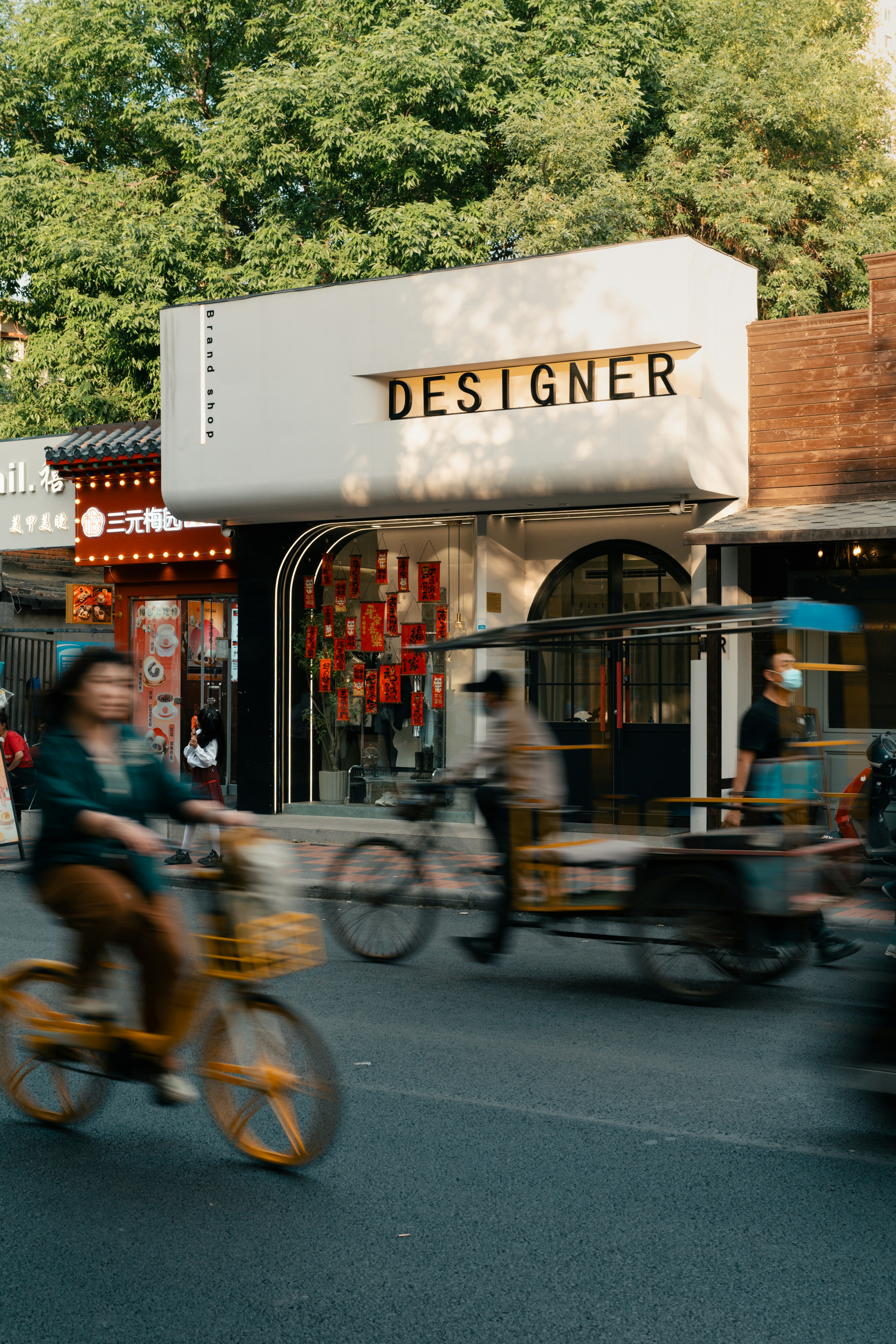 Bicycles and a designer shop along the street.