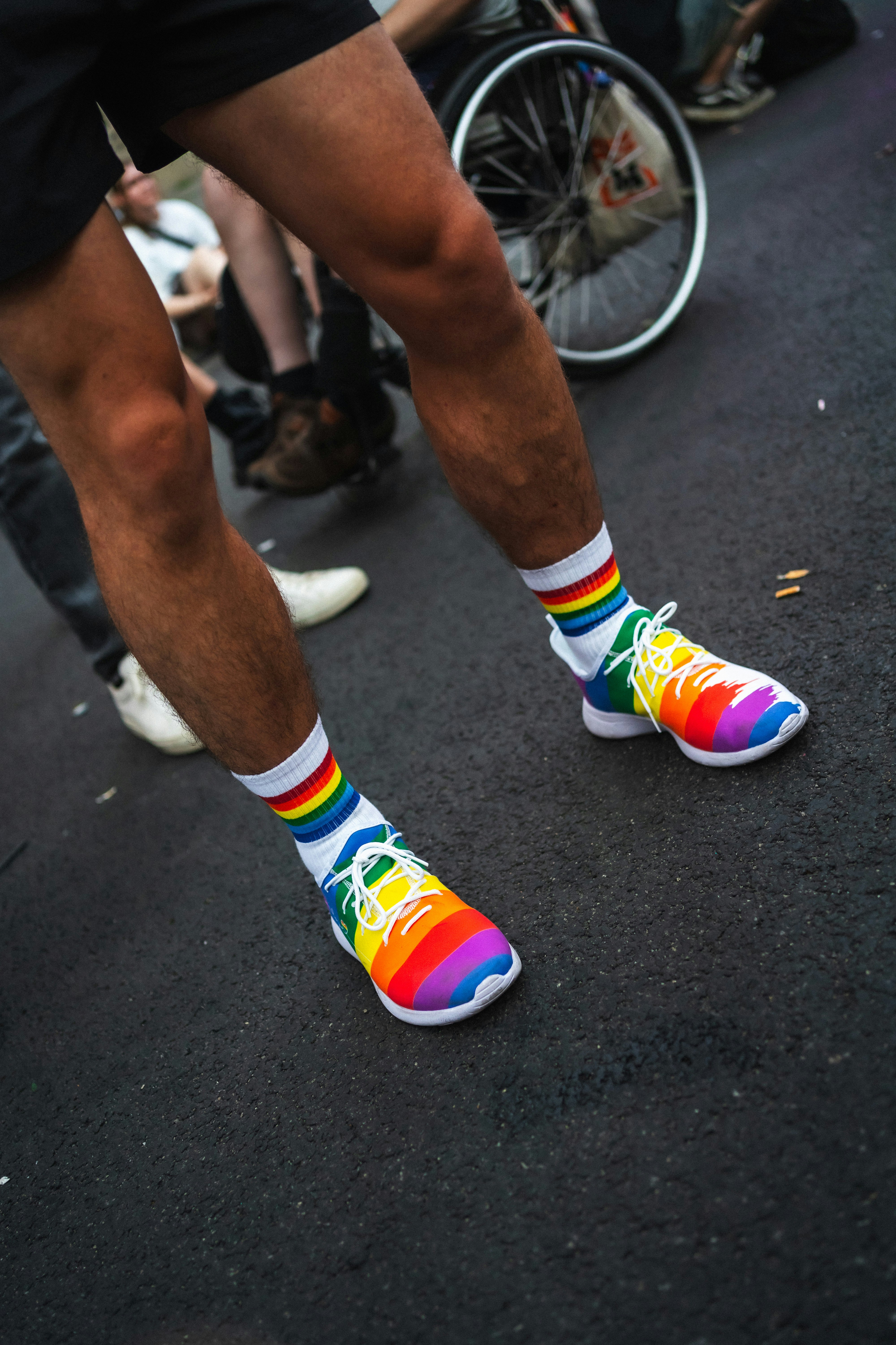 Raphael Renter @ CSD Munich 2025 - Walking Rainbows | Rainbow socks and shoes are on display.