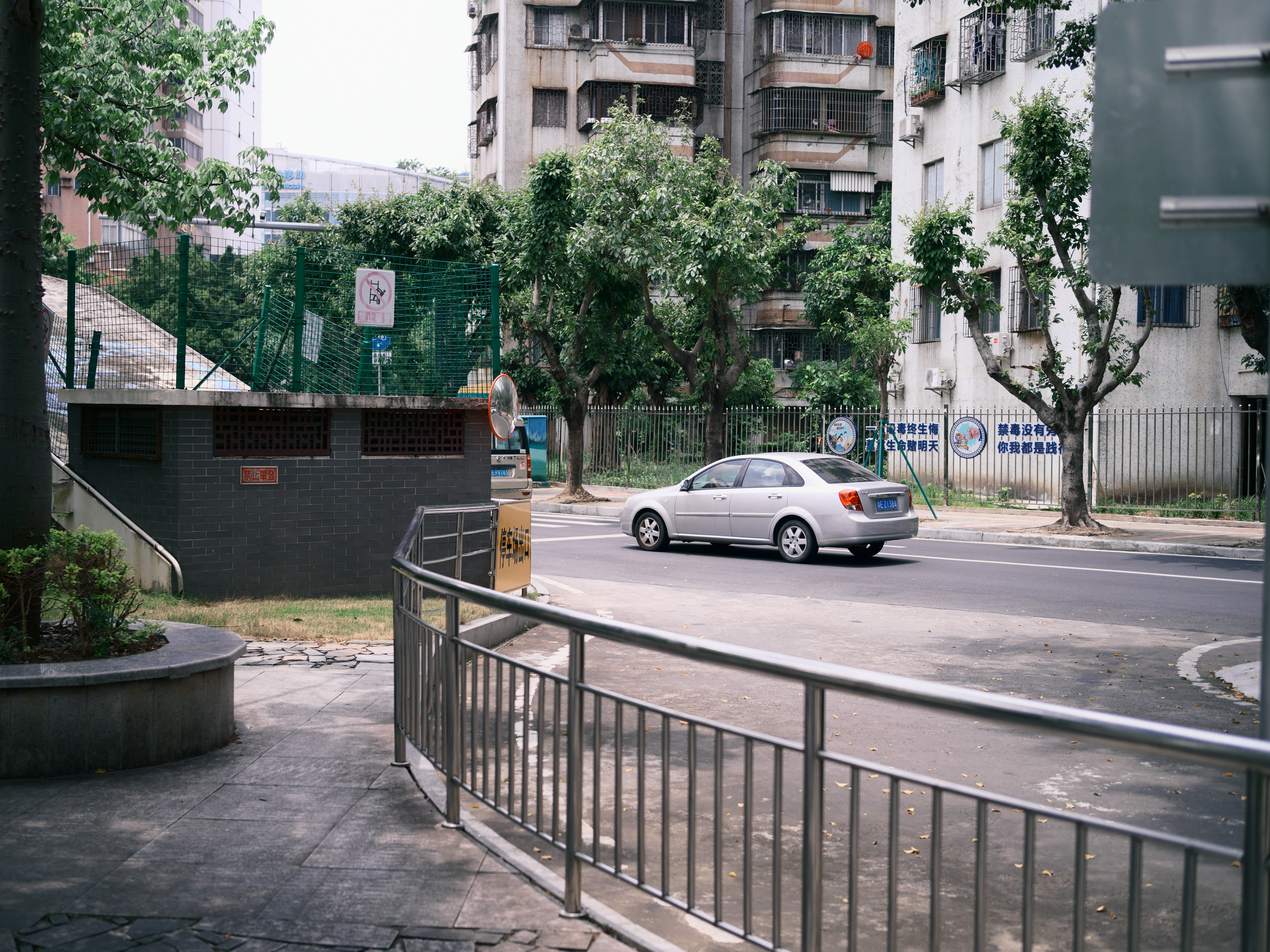 A car drives on a city street.
