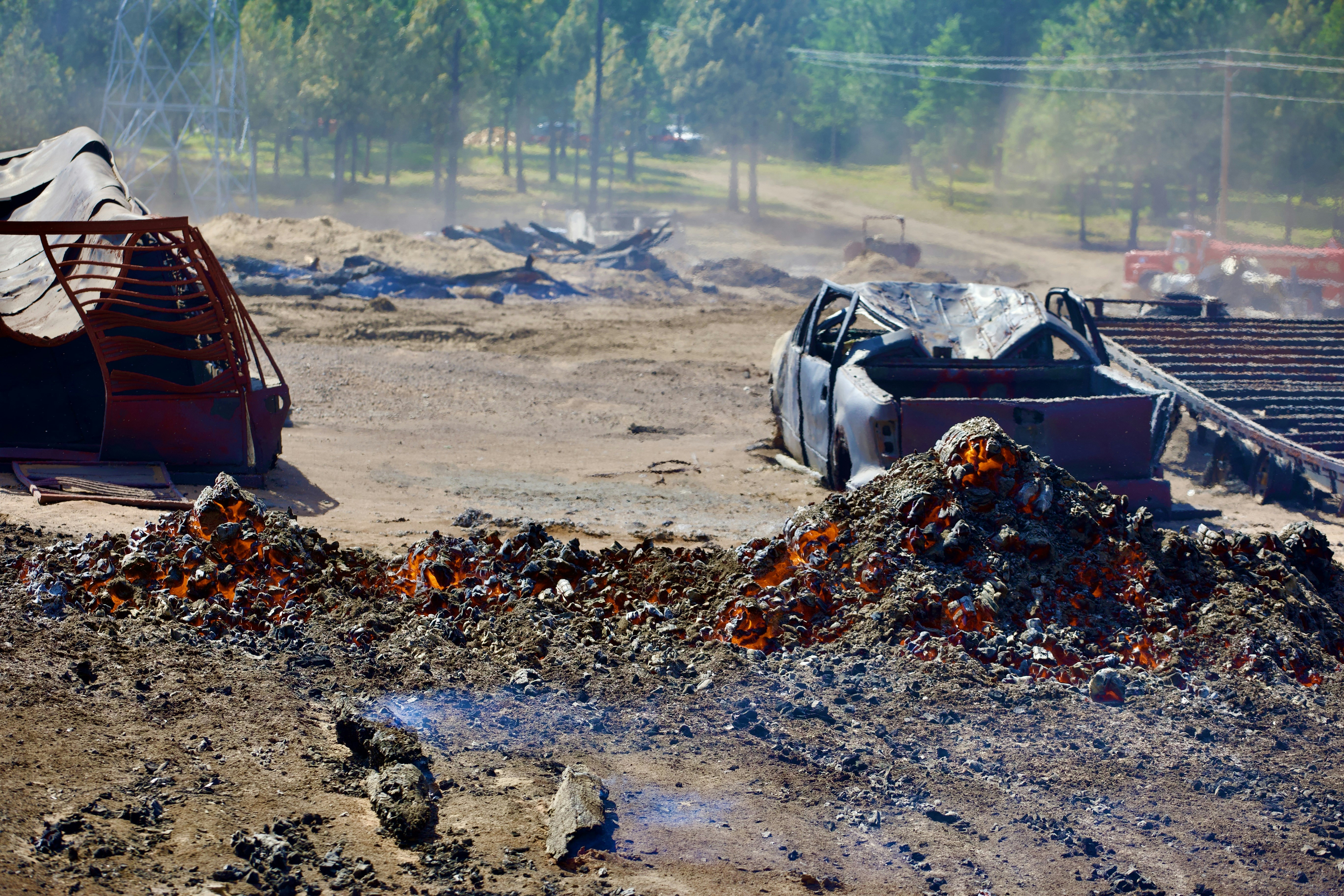 Burnt Debris and Dumped Machinery at a Construction Site
