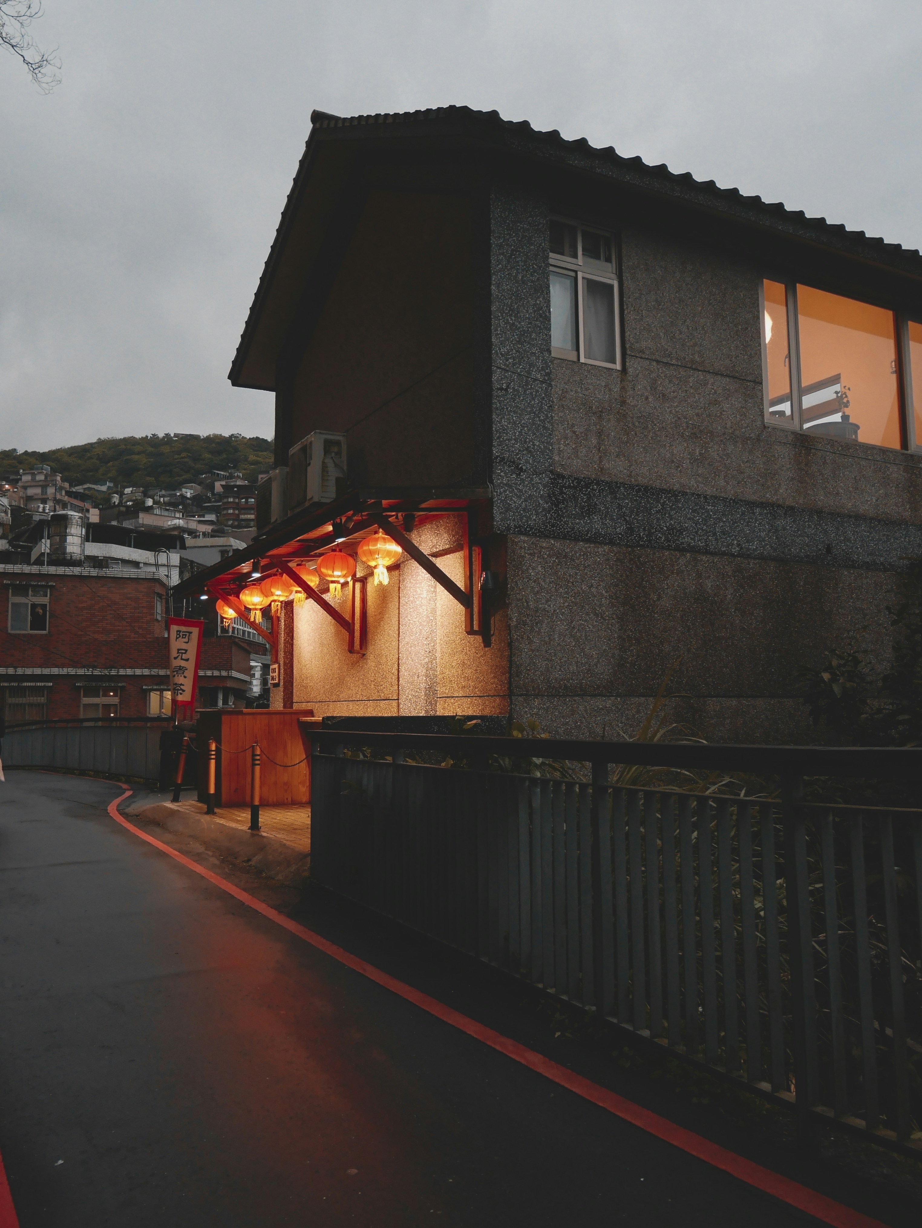 A ordinary restaurant showing a unique vibe. | A house is illuminated at dusk.