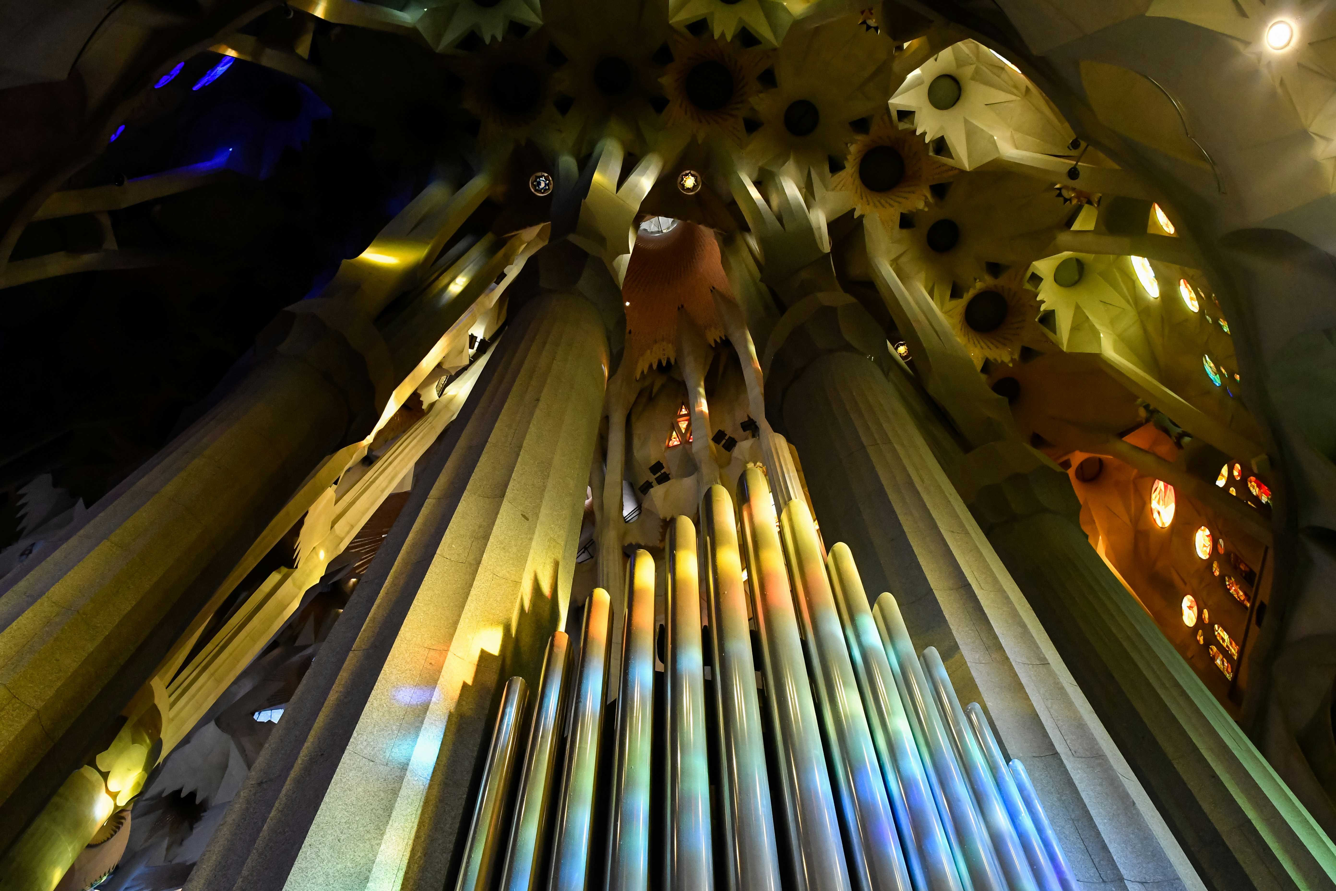 Prismatic Cathedral: Light-Tipped Columns Ascend Toward a Sunlit Vault