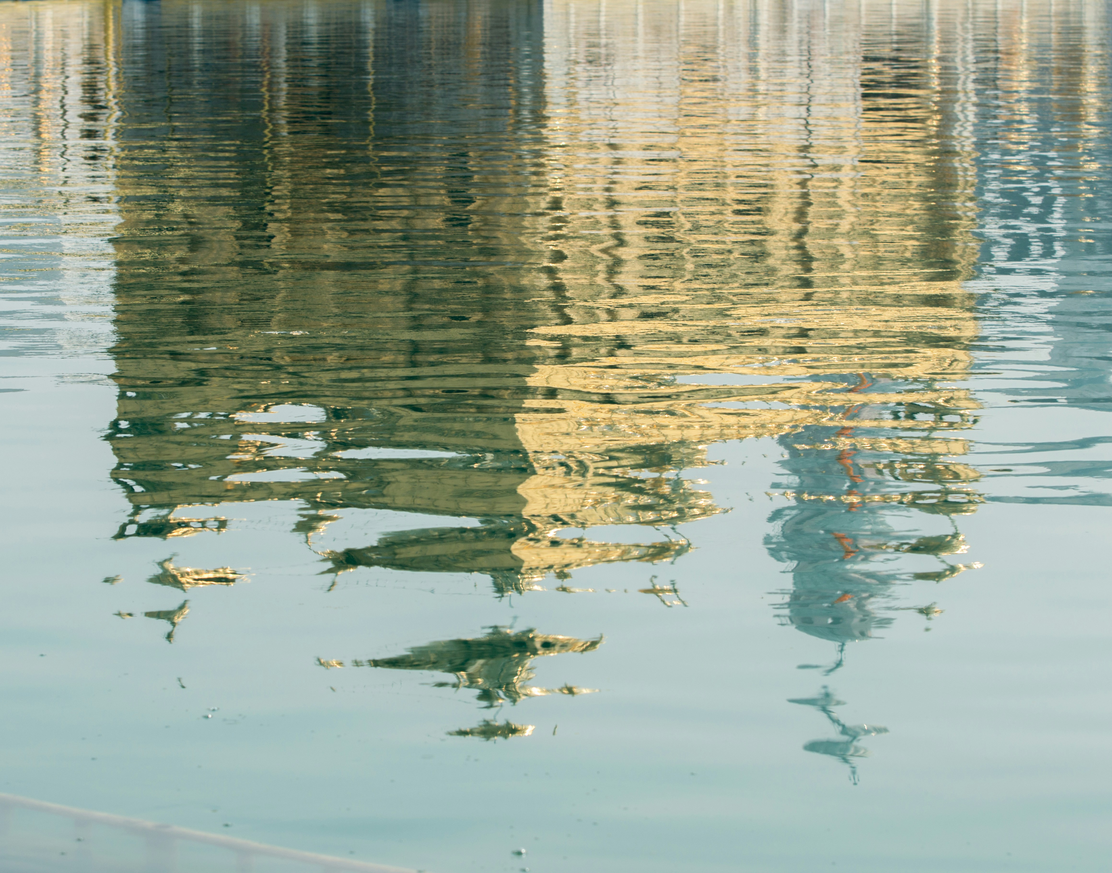 Reflection of a building on water.