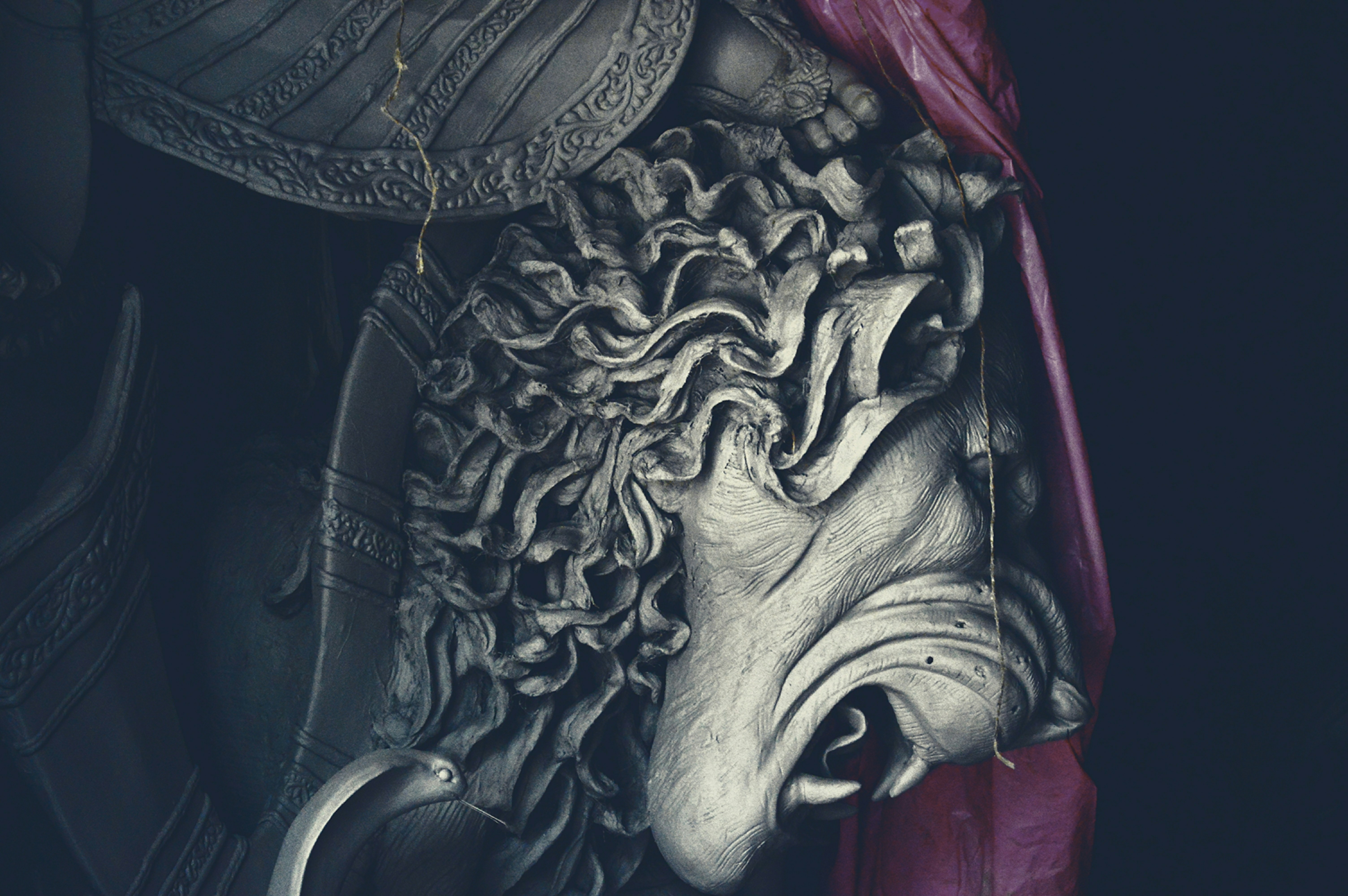 A stone sculpture of a face.