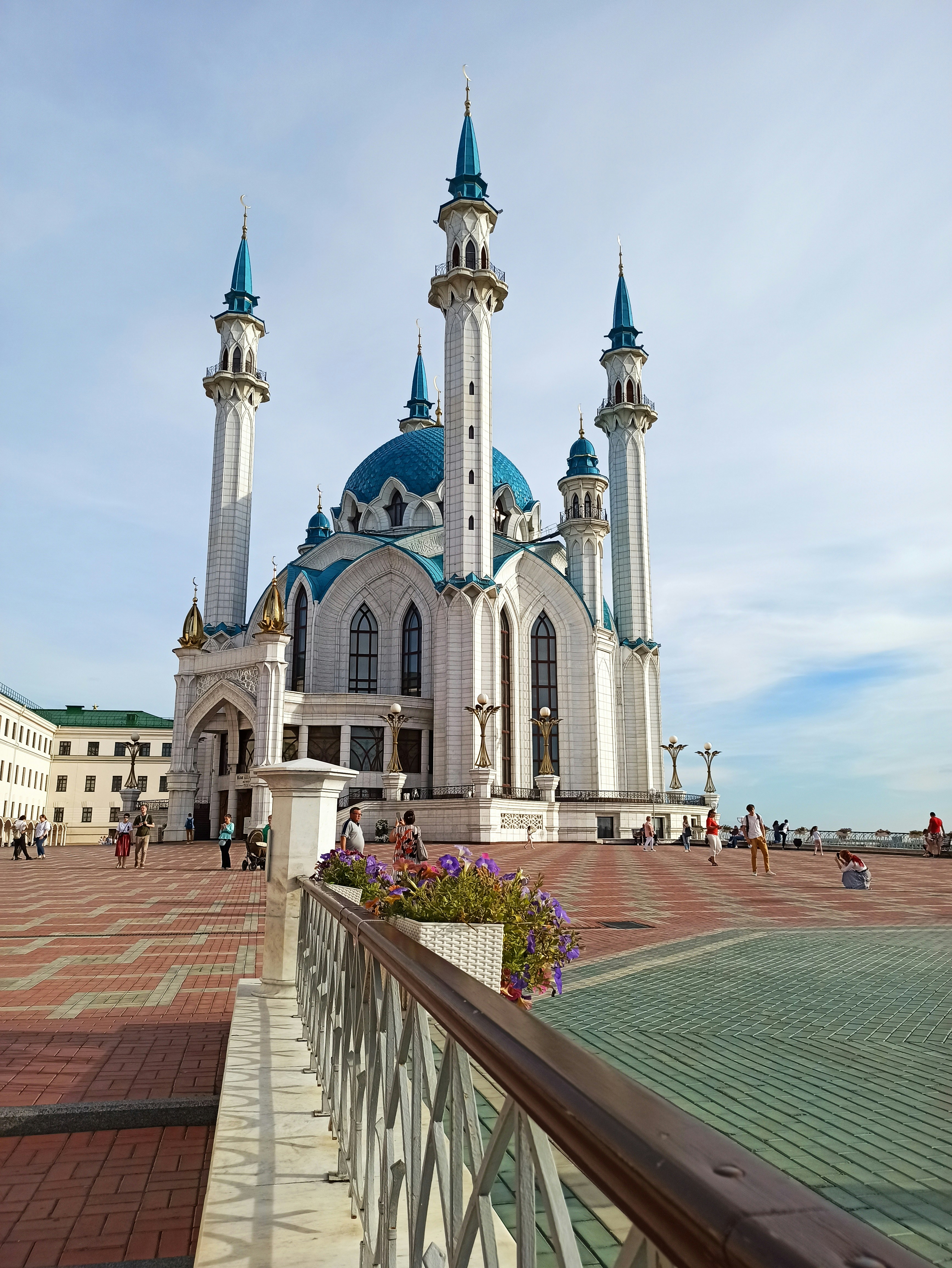 A beautiful mosque with blue domes and minarets.