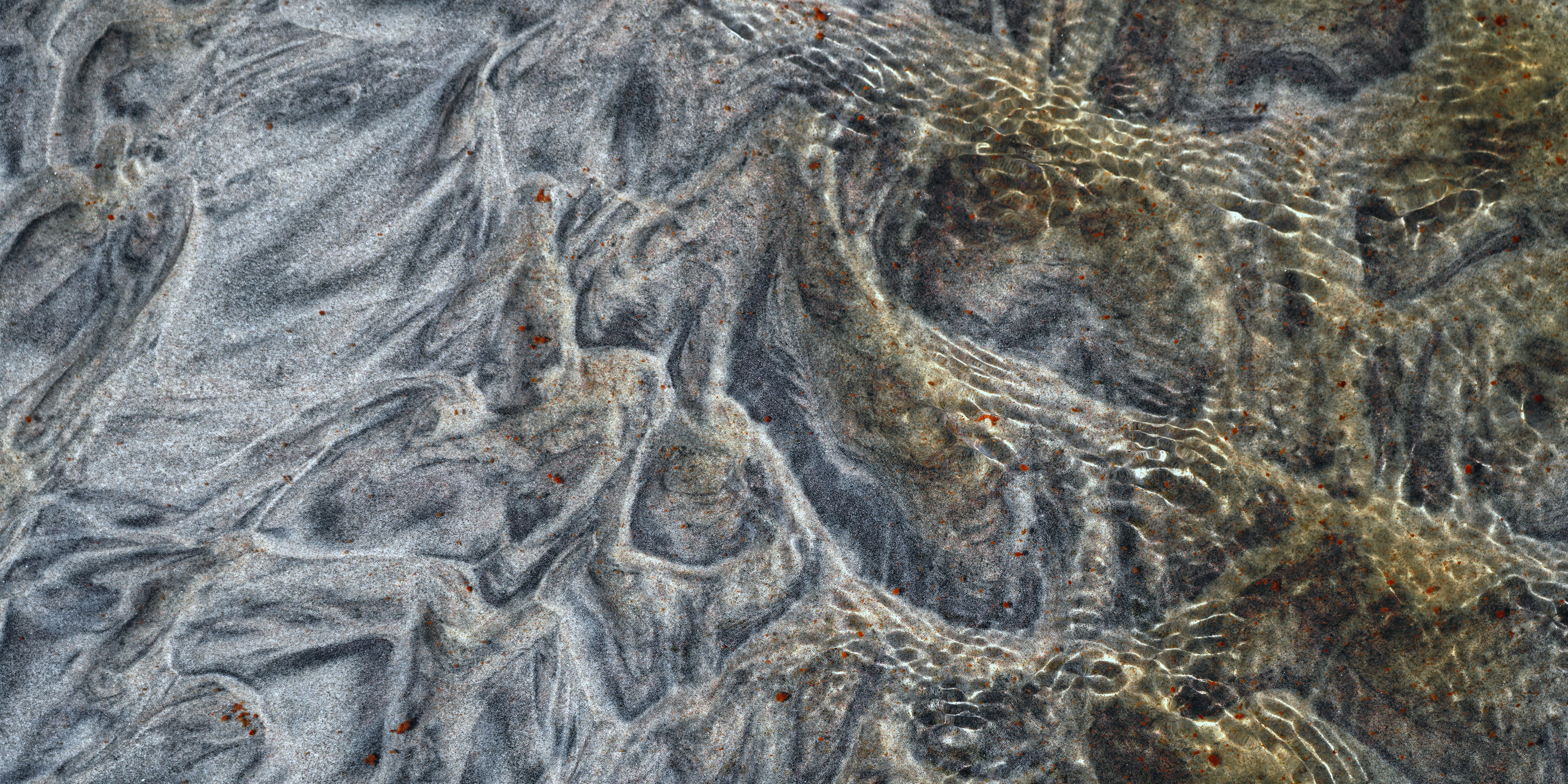 Abstract texture with swirled lines and shades.