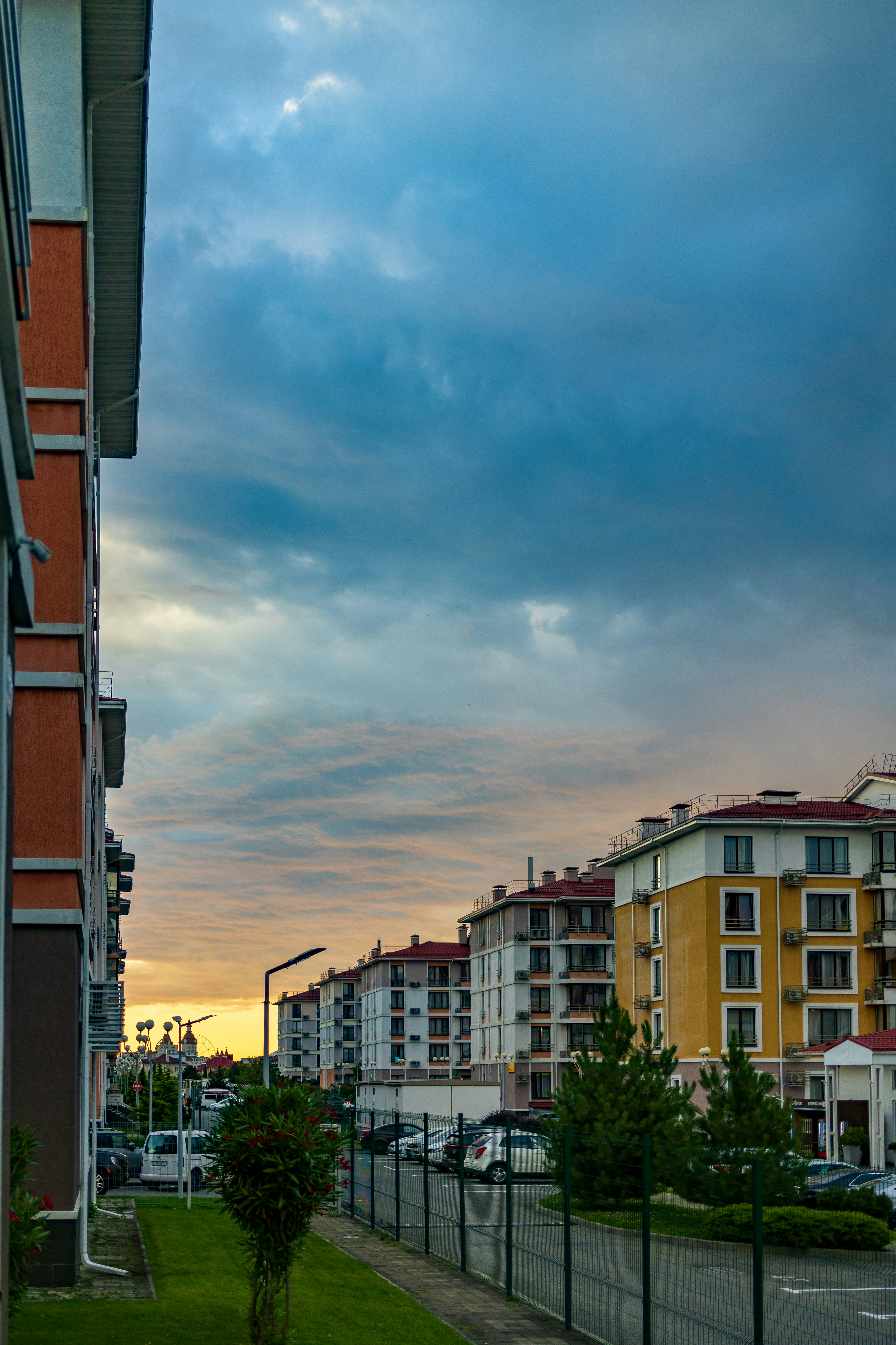 Buildings and a cloudy sky create an urban view.