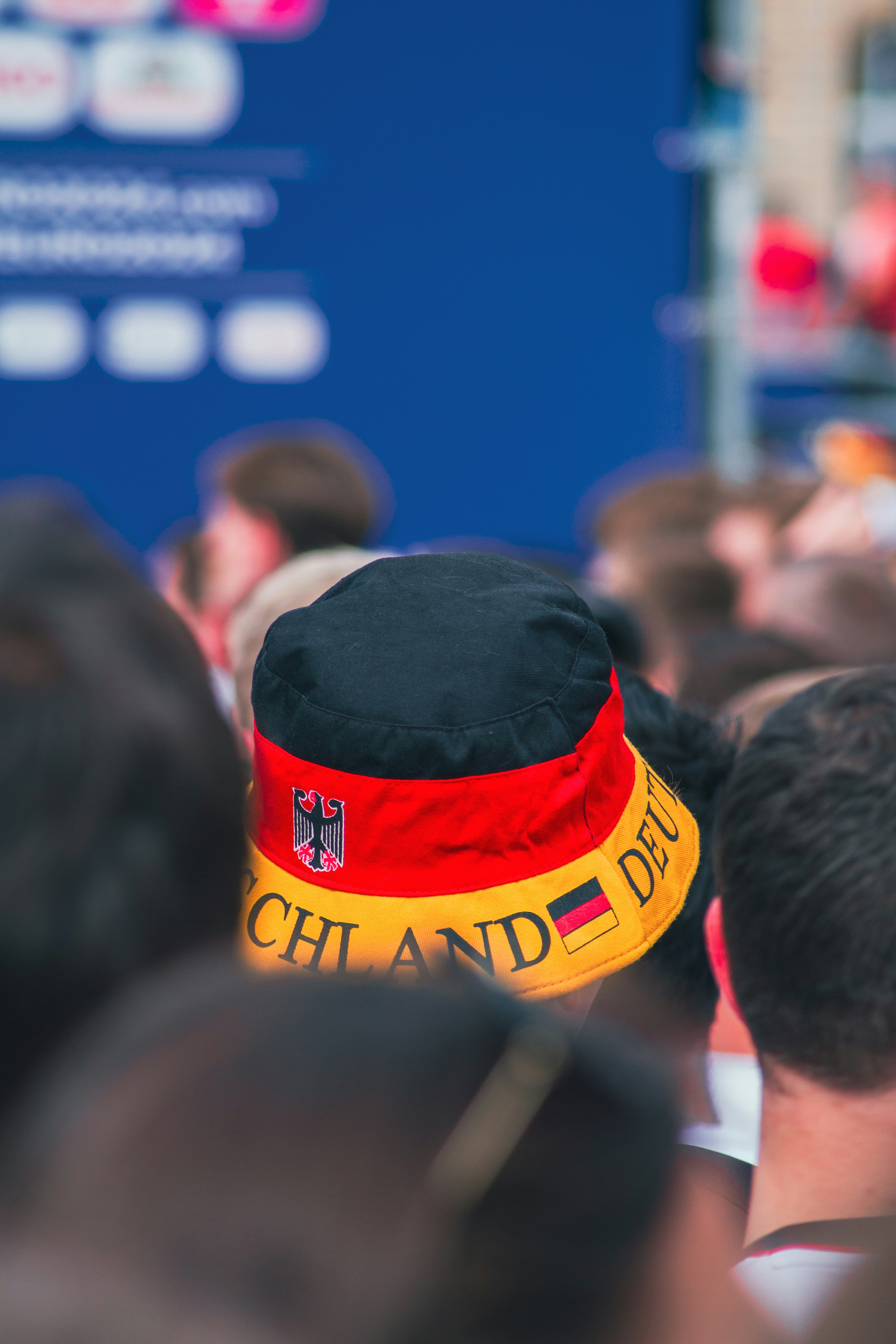 Germany | A person wearing a german flag hat.
