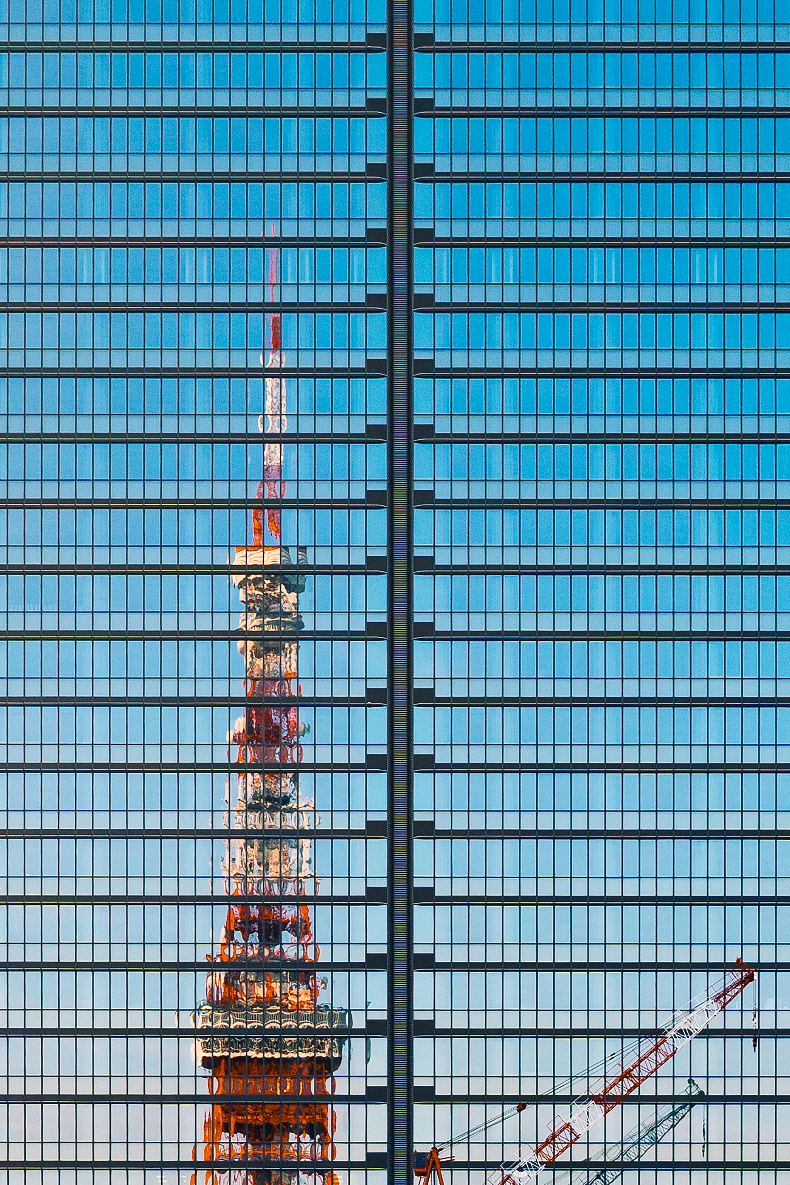 Reflections of Modernity: Tokyo Tower Through Glass