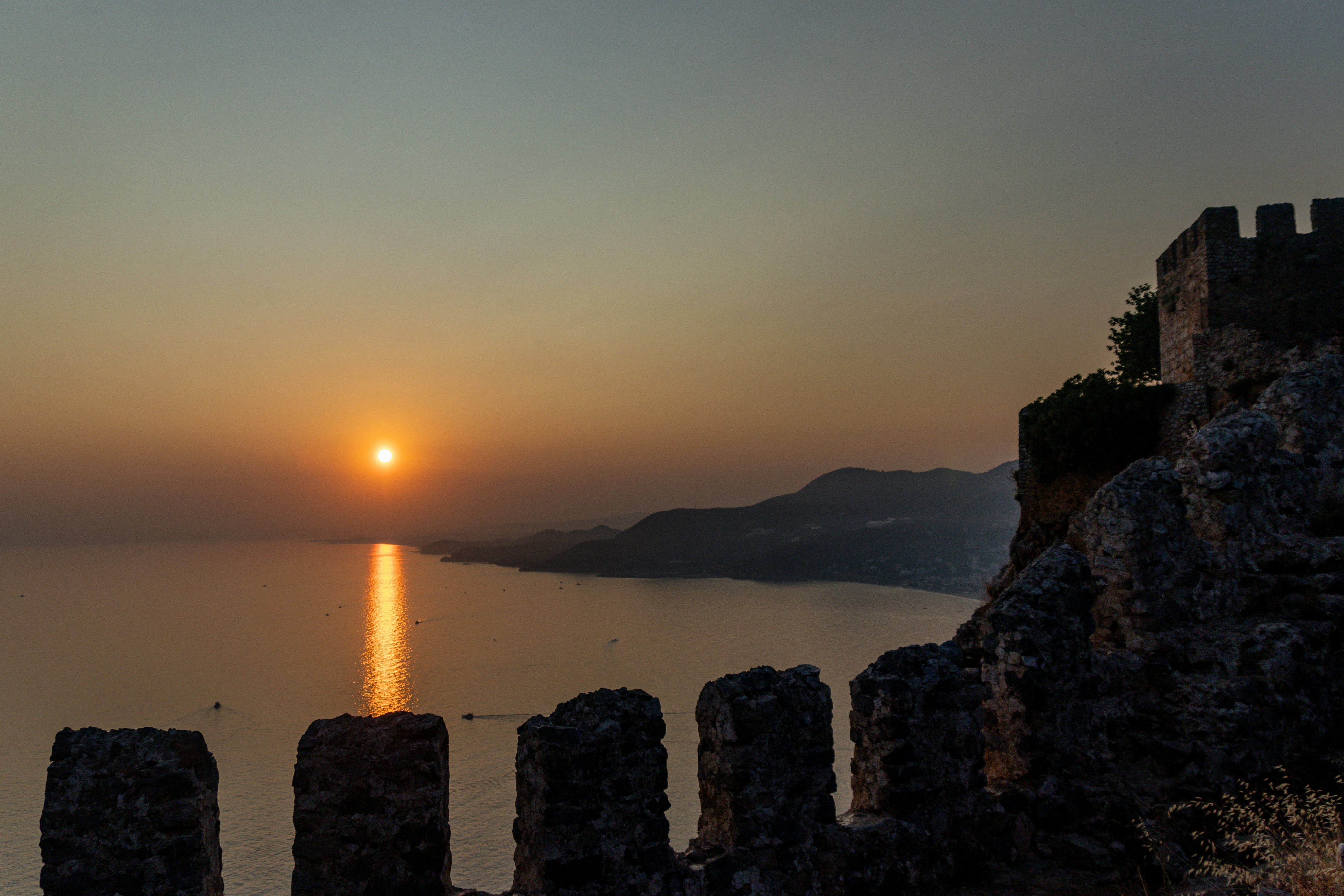 Sunset Sentinel over Stone and Sea: Fortress at Dusk