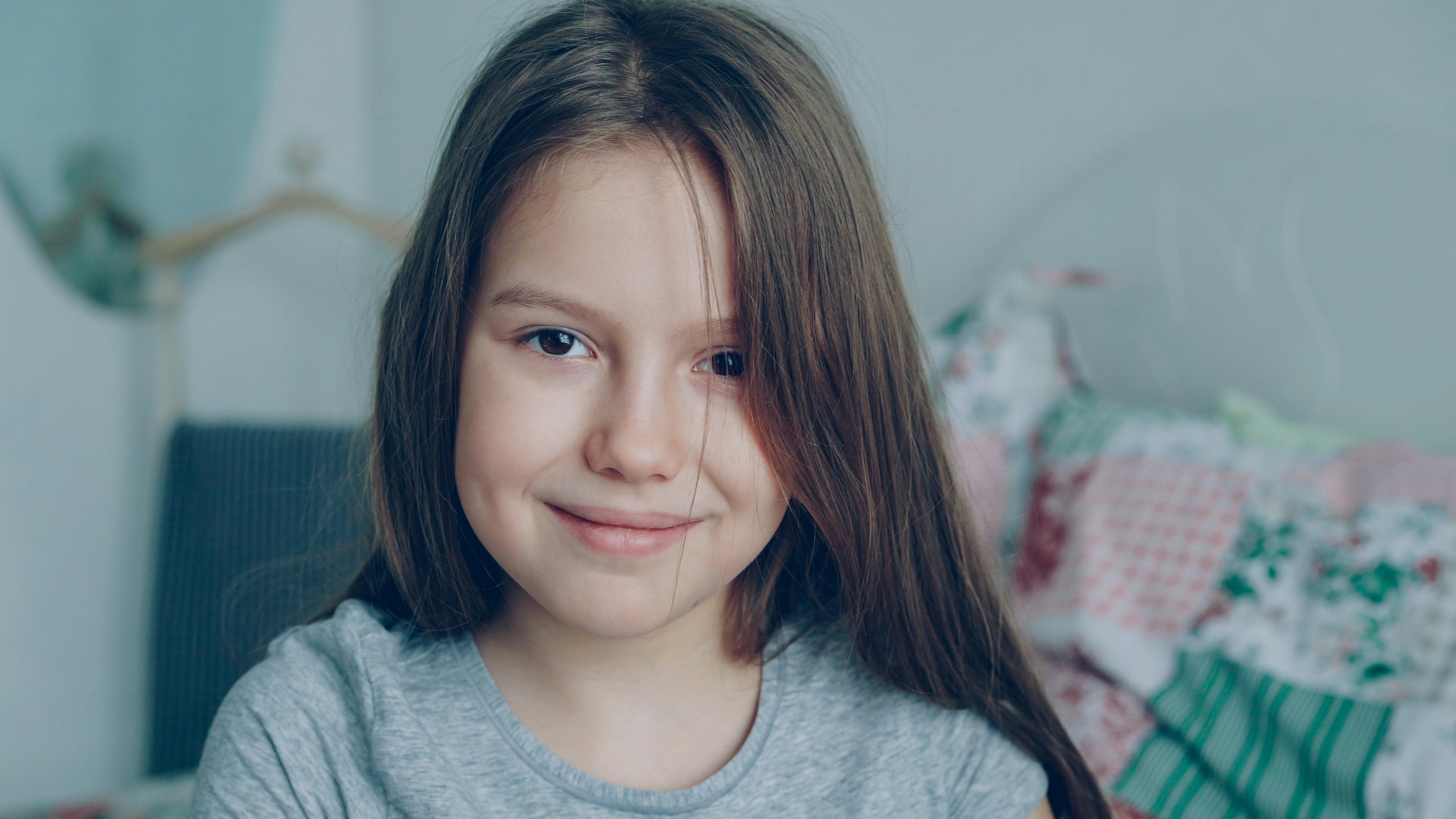 A young girl smiles directly at the camera. photo – Free Portrait Image ...