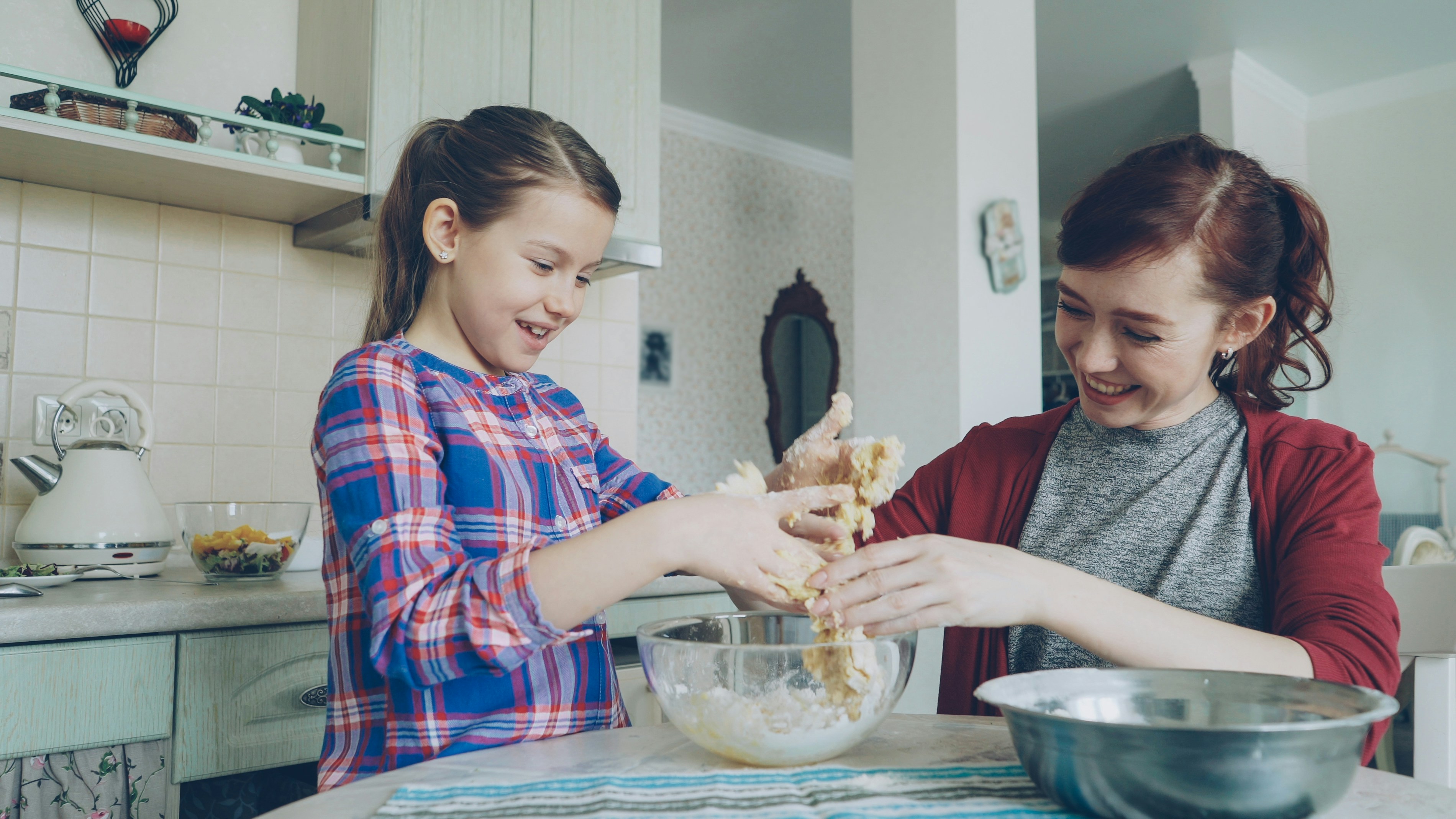 Two girls are happily baking together in the kitchen. photo – Free Girl ...