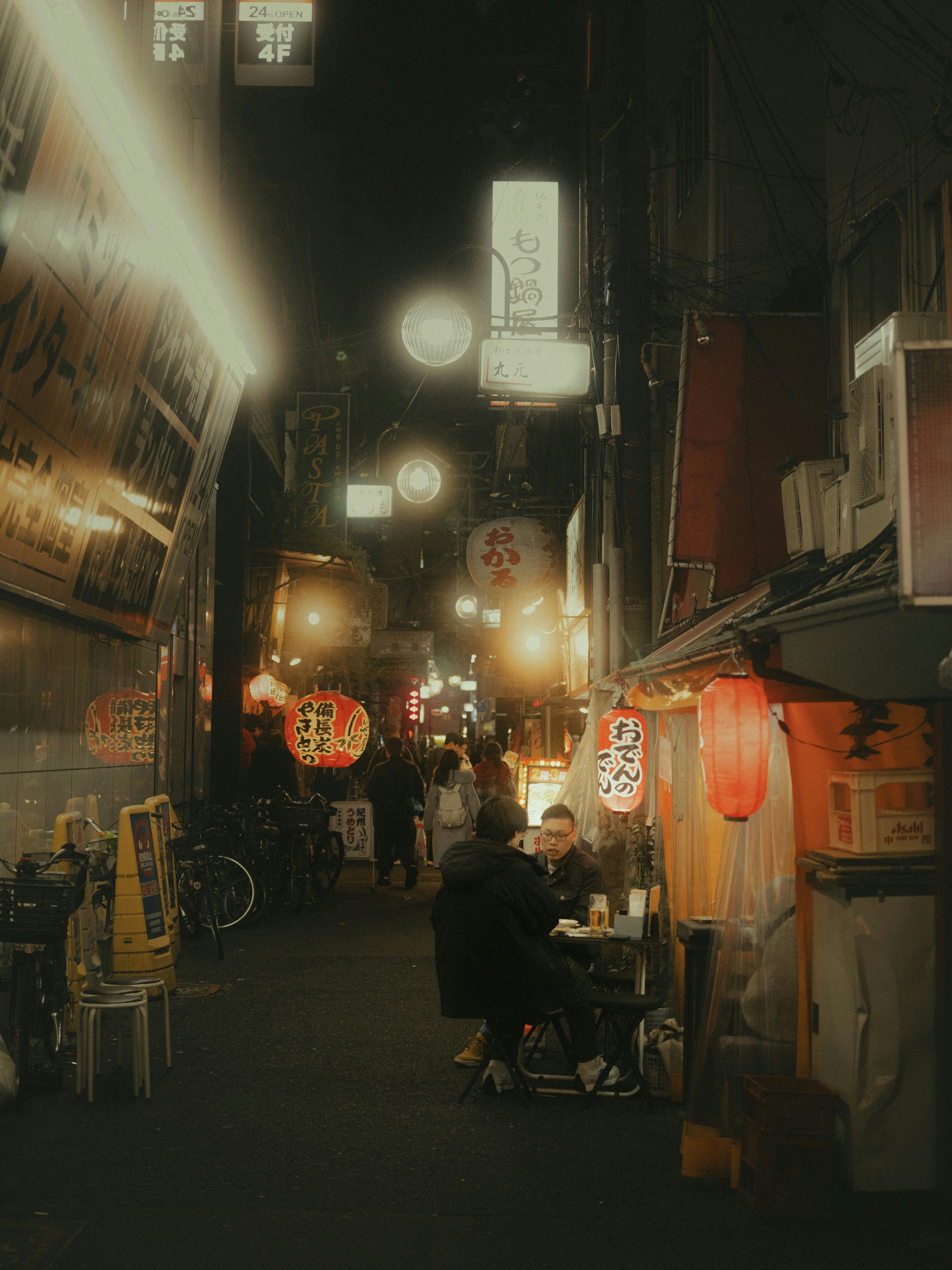 Dimly lit alleyway in a bustling city at night. photo – Free Street ...