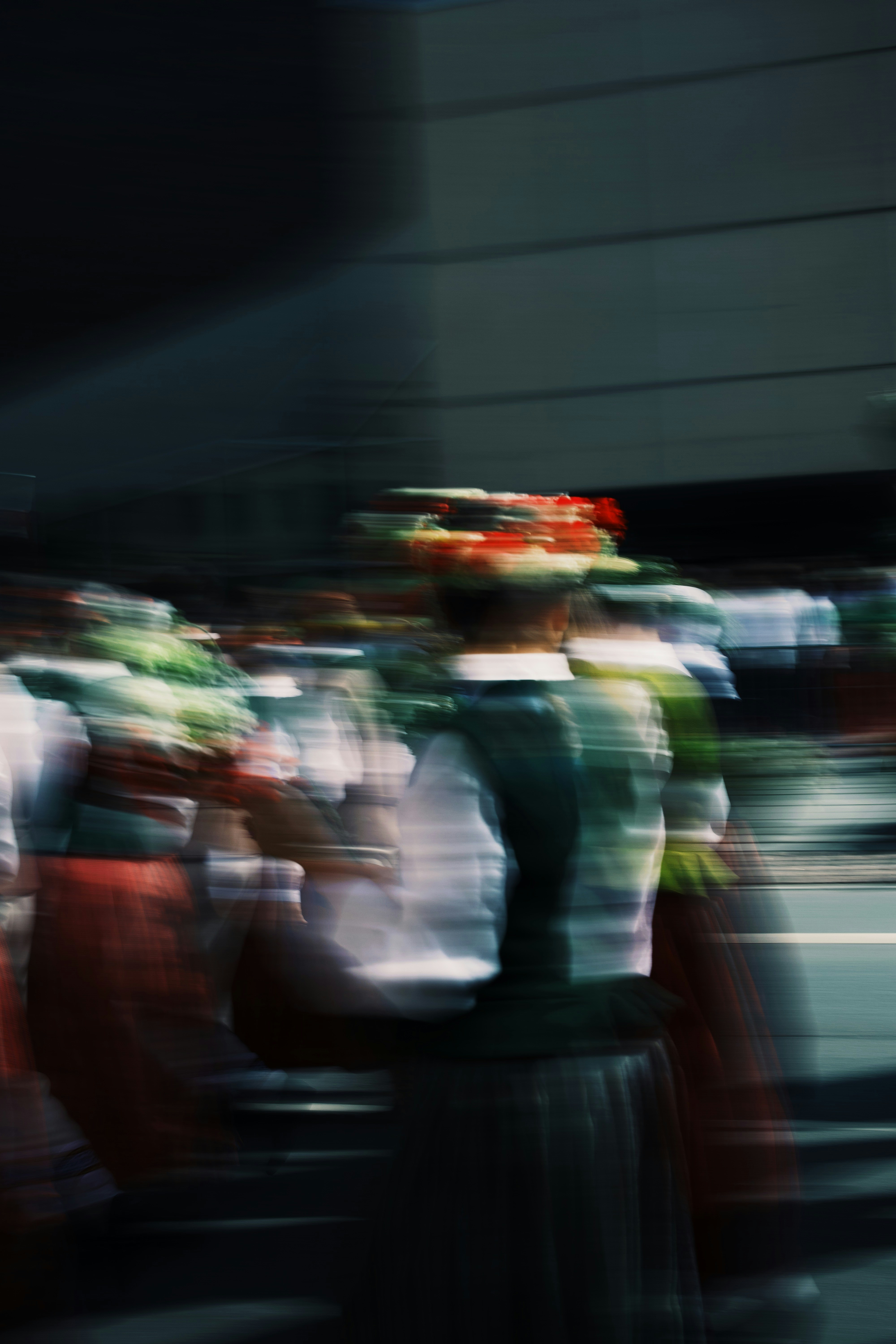 Participants in traditional attire swirl in motion during a vibrant cultural parade, showcasing their heritage and community spirit.