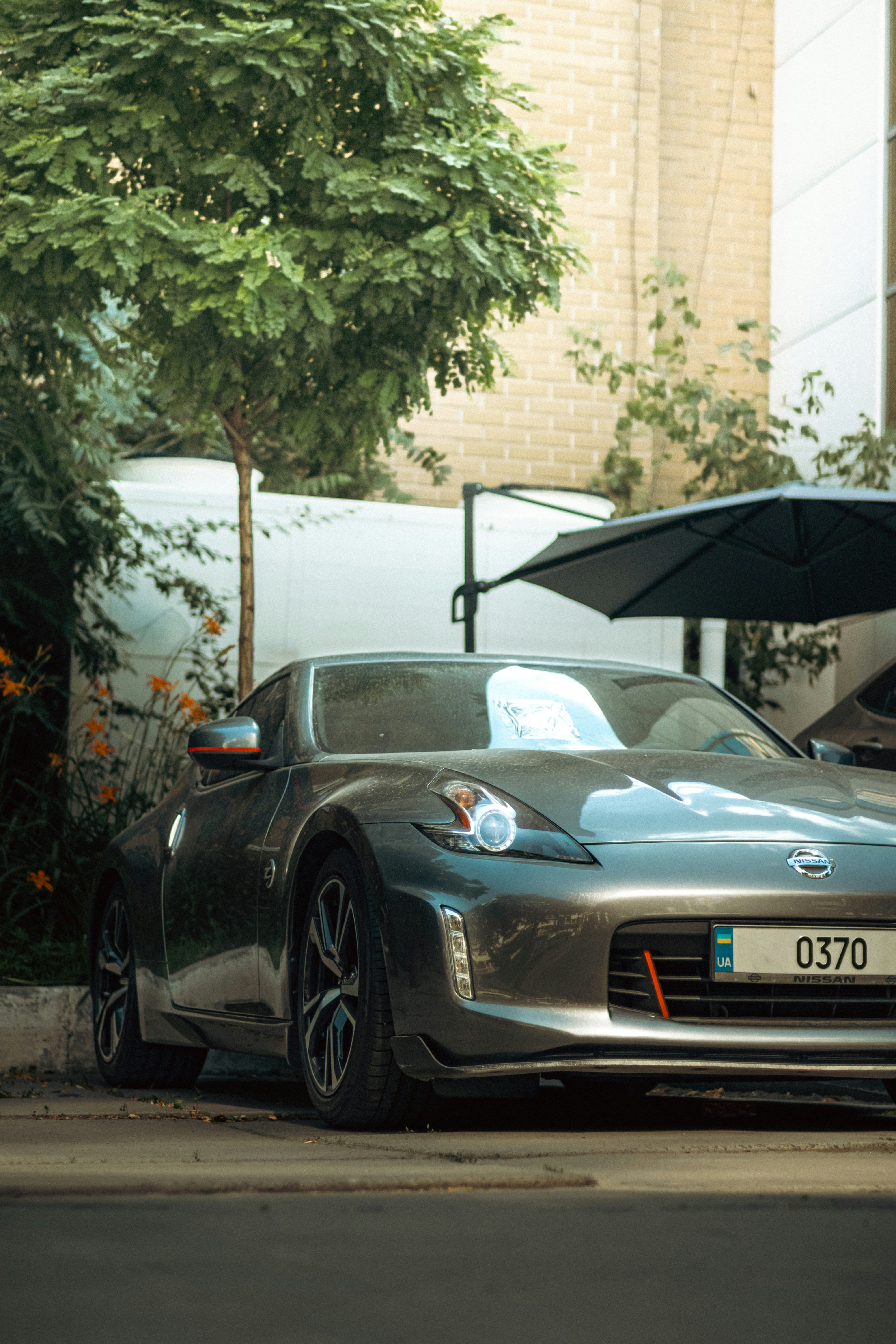Chrome in the Courtyard: A Nissan Resting Under Shade
