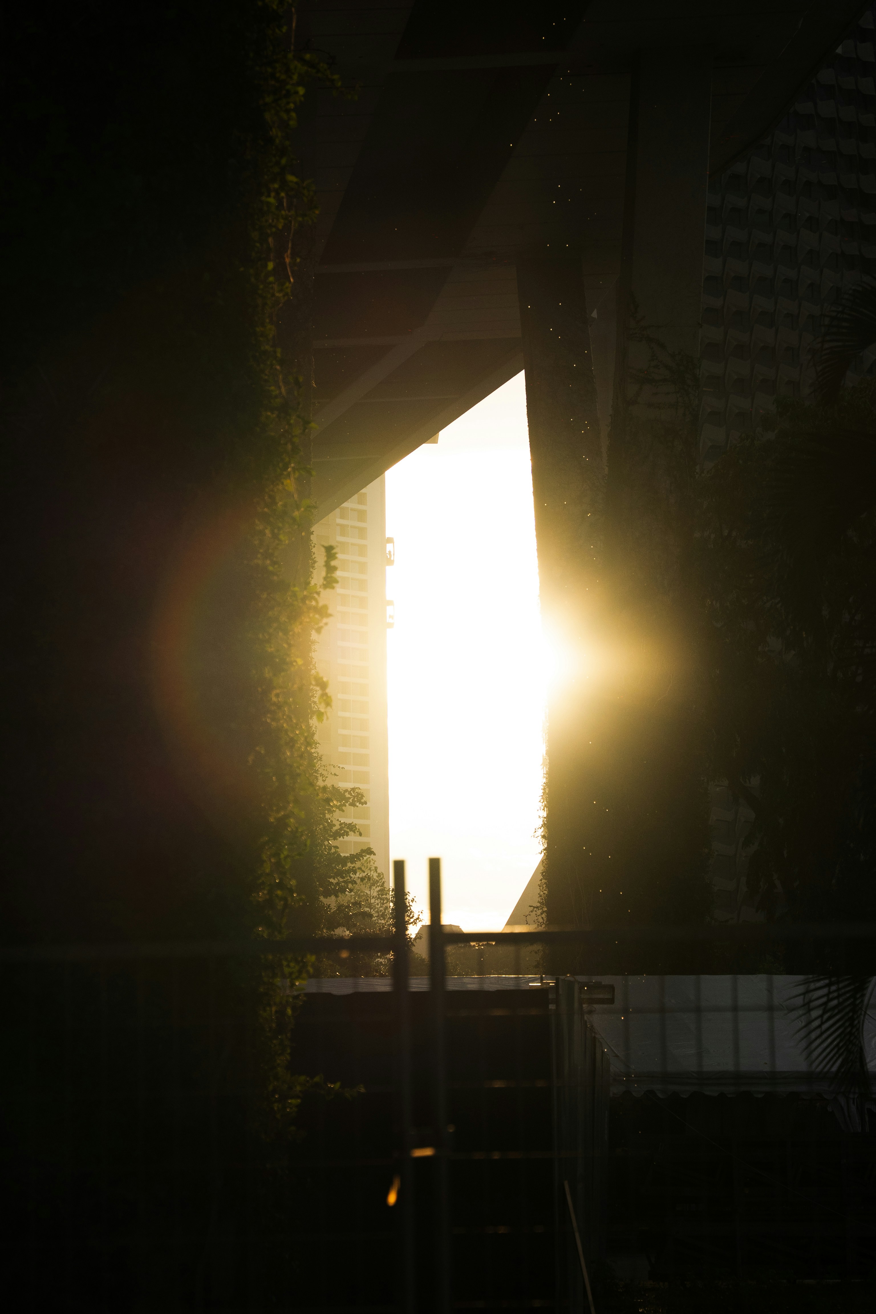 Sunlight streams through an opening in a building.