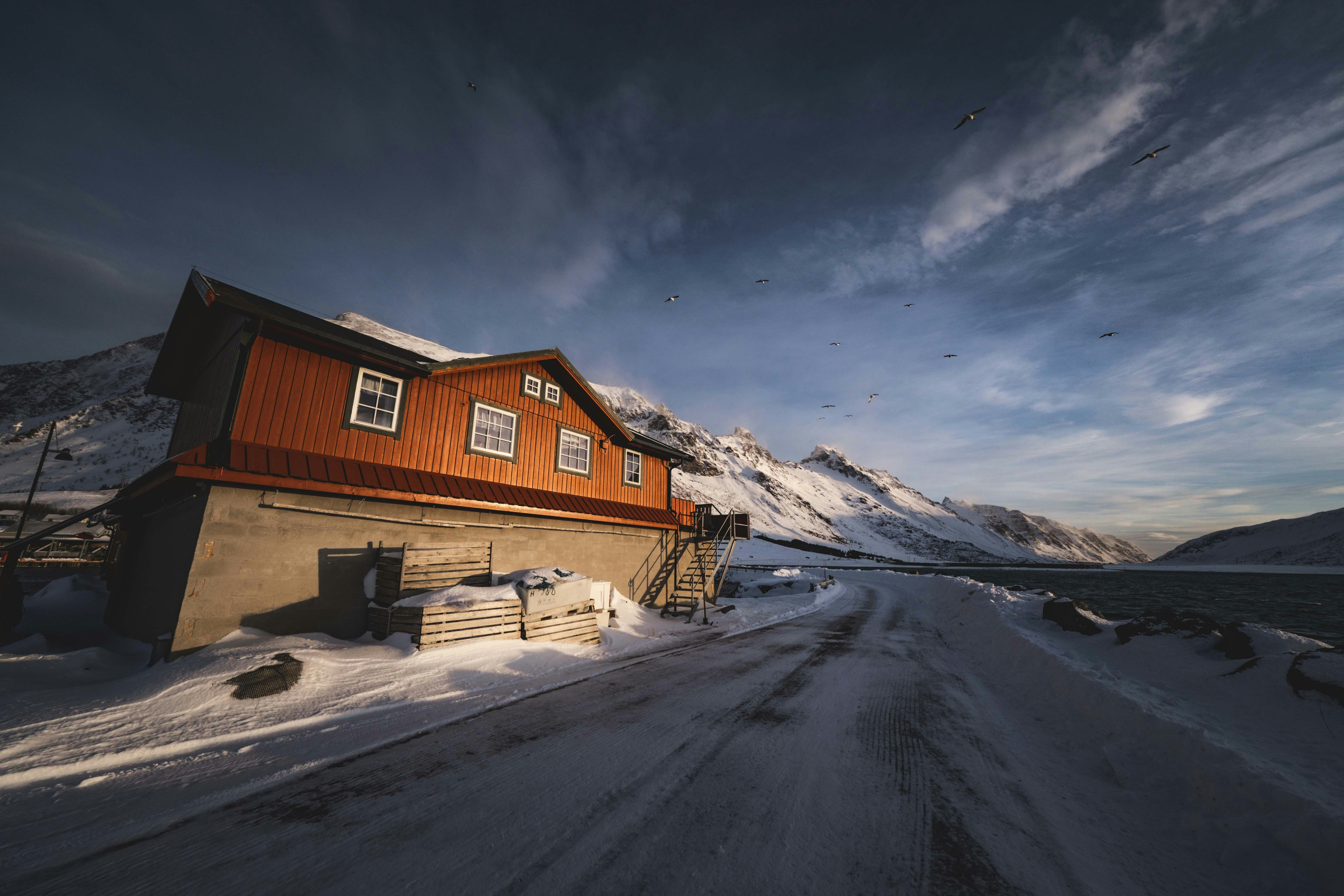 Rustic Refuge Amidst the Snow-Capped Peaks