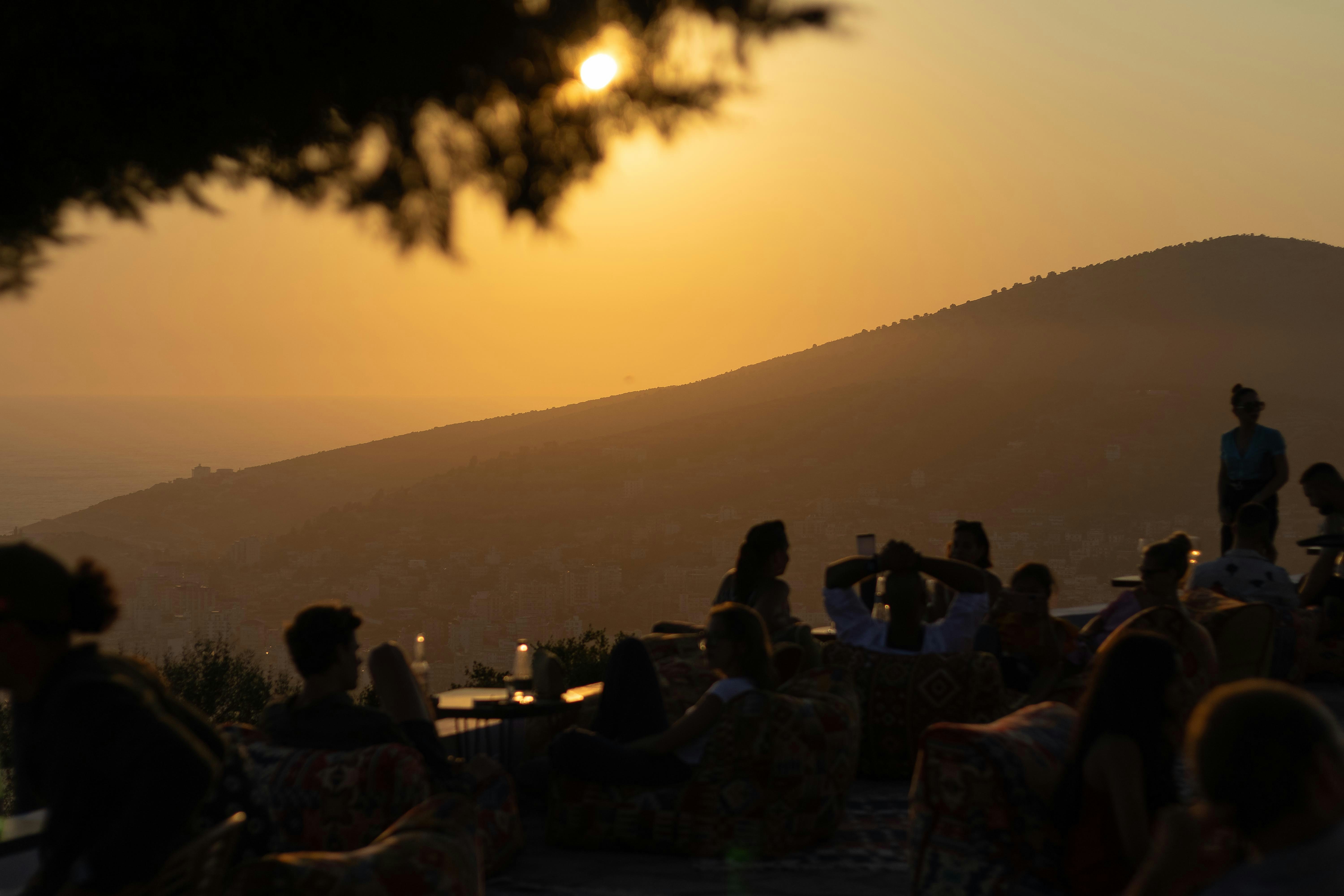 Terrace Dusk: Silhouettes and a Golden Horizon