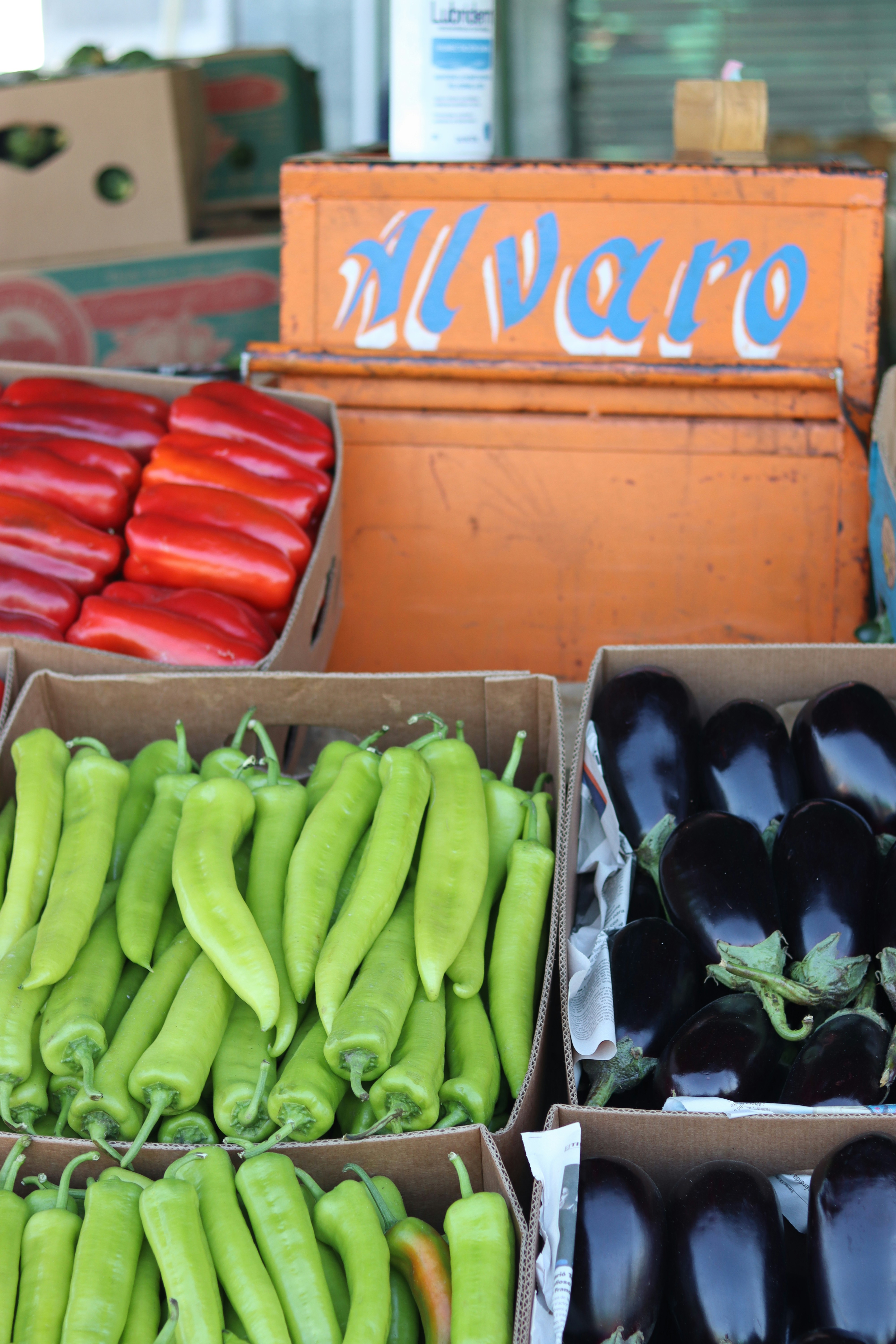 Emerald Stacks: Fresh Green Chilies Beckon in a Busy Market Stall